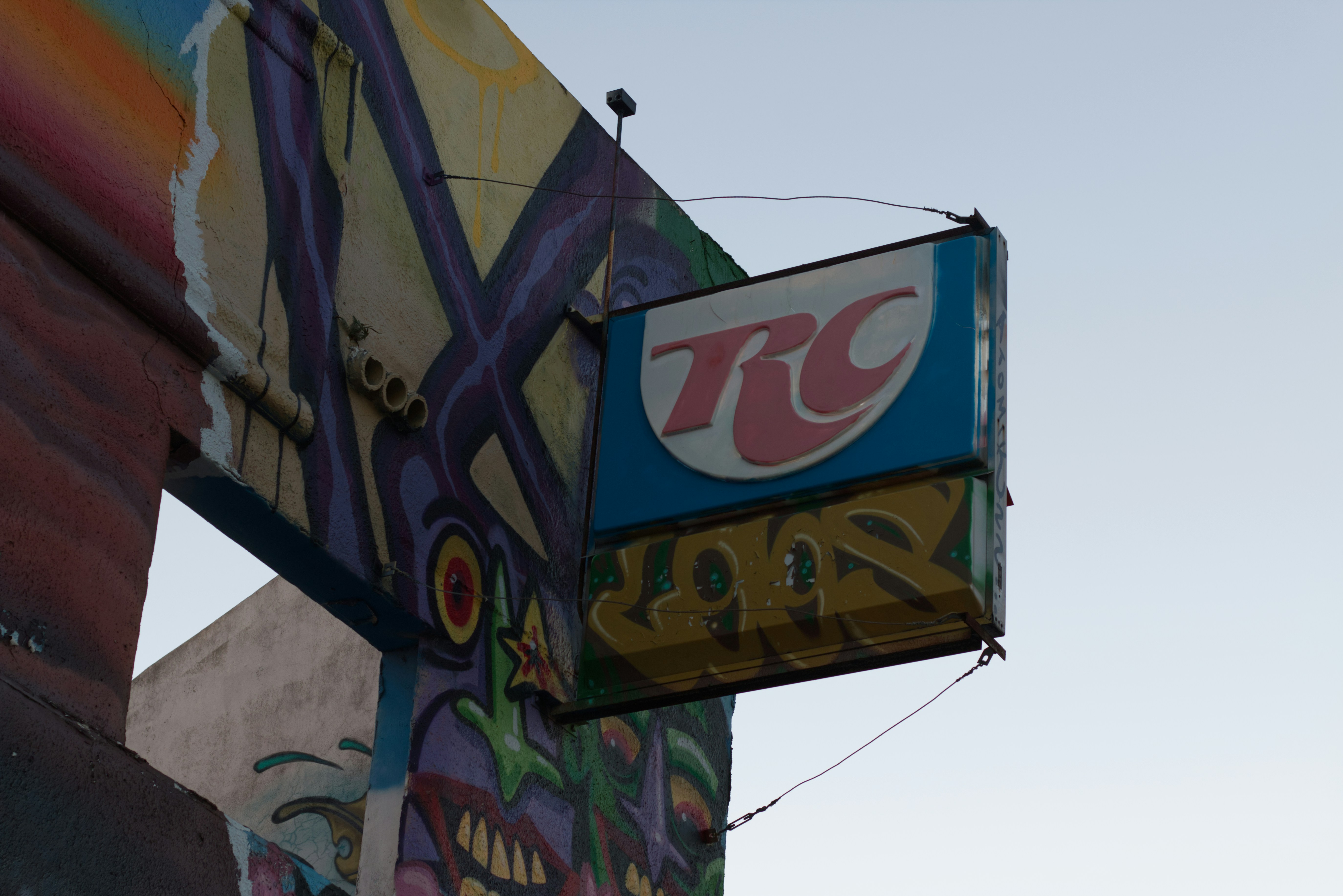 Graffiti Tower Sign: A Pop of Color Above the Concrete