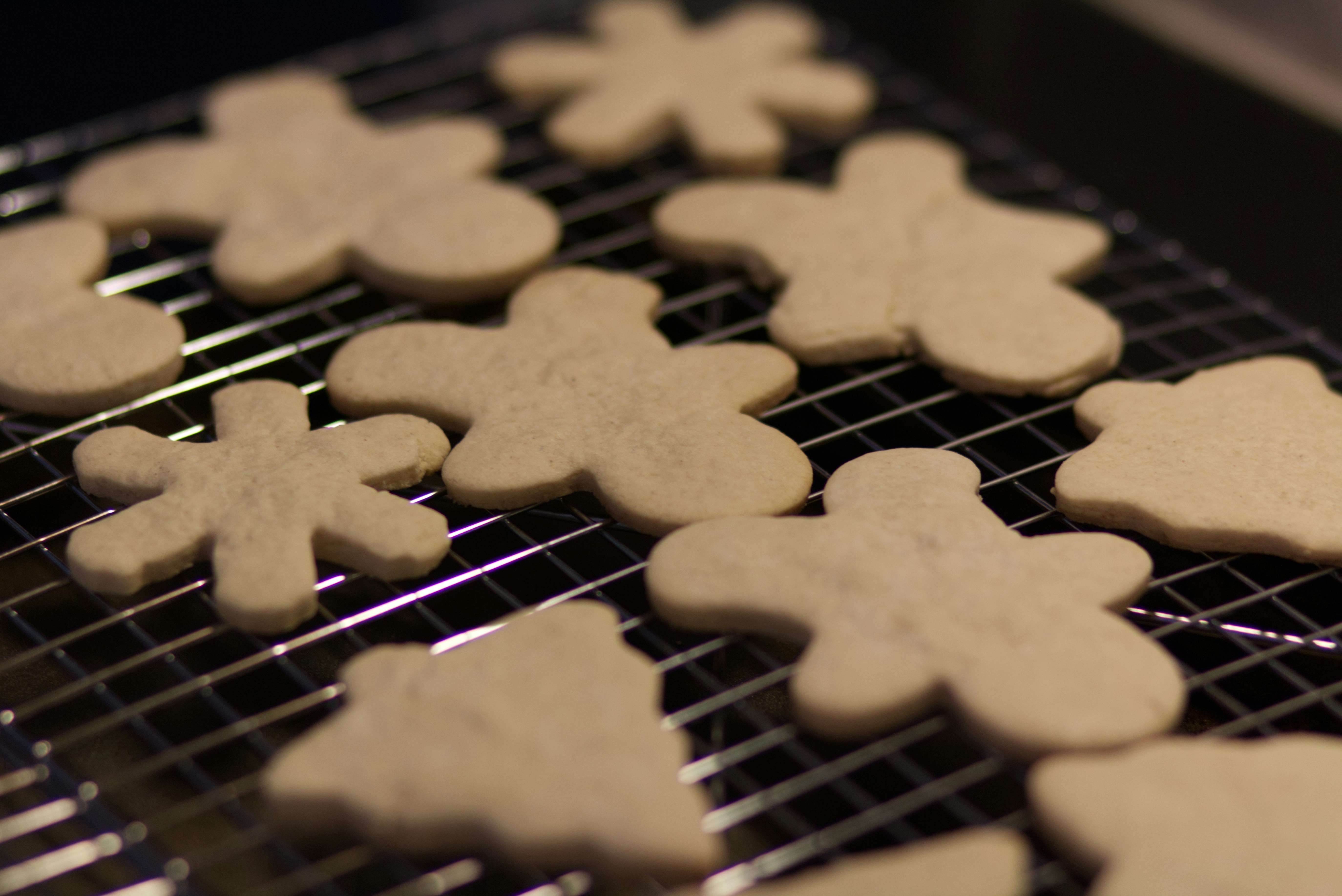 Baked Gingerbread Shapes Resting on a Cooling Rack
