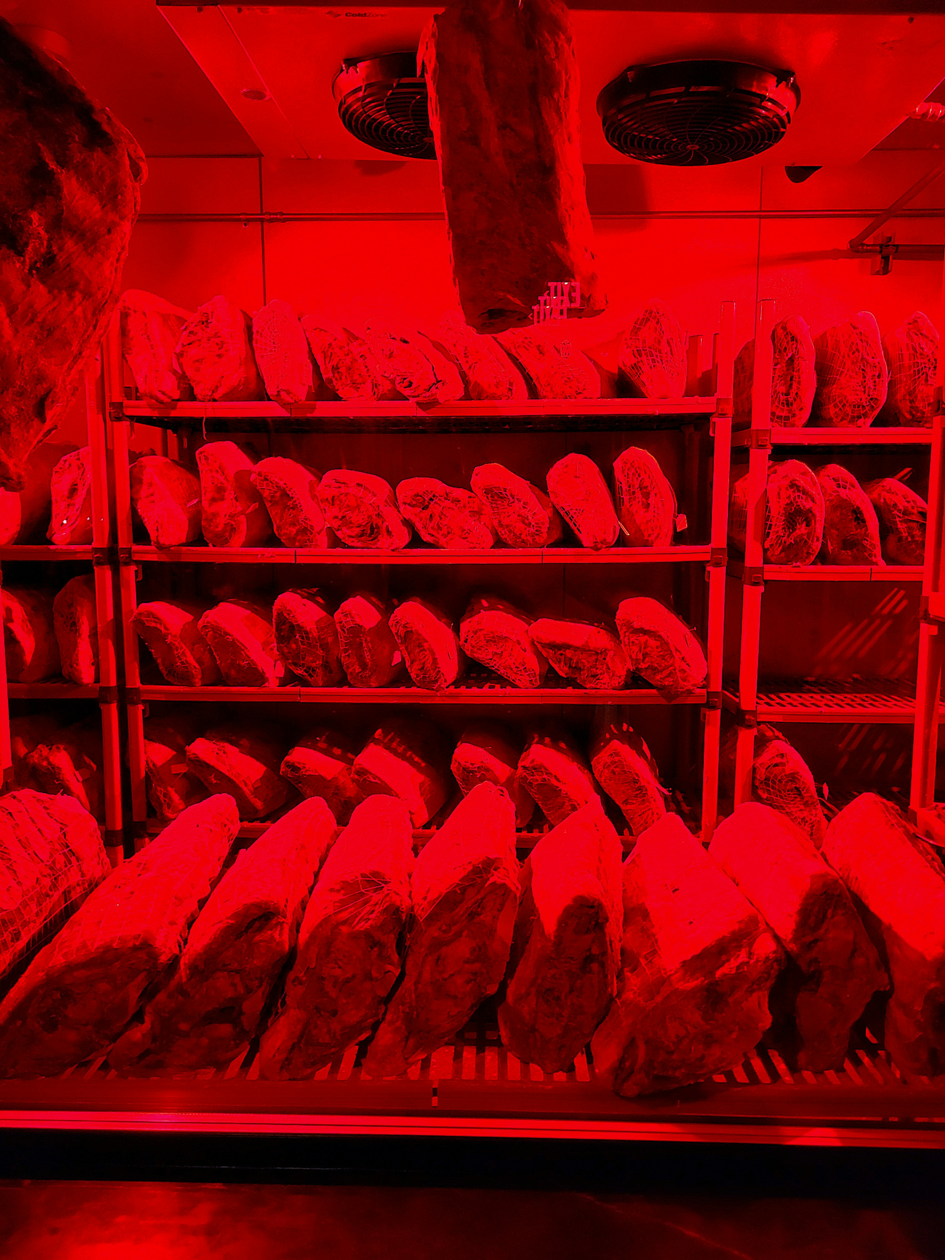 Crimson Bakery: Rows of Loaves under a Red Studio Glow