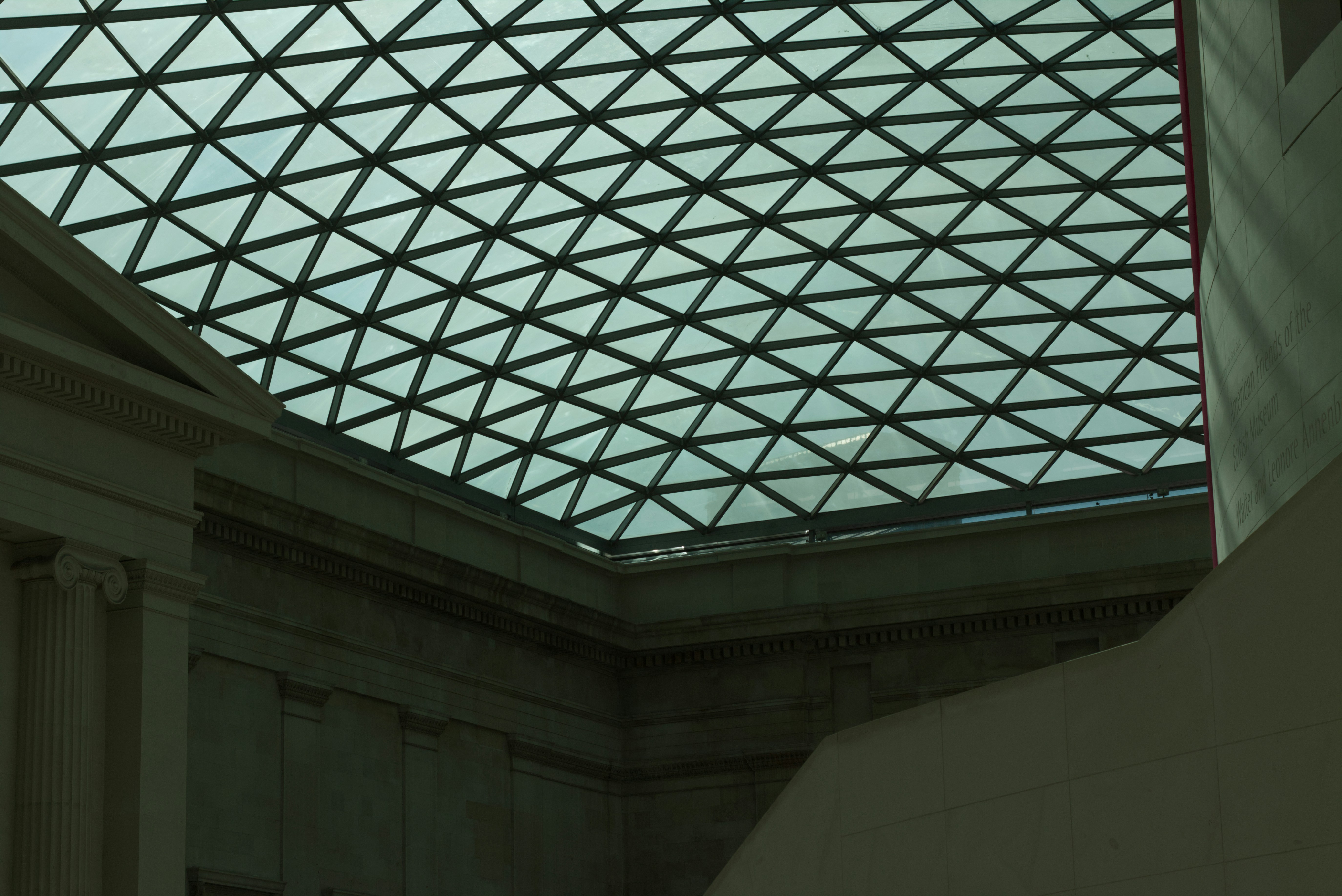 Glazed Grid Overhead: Geometry and Cornice in Quiet Light