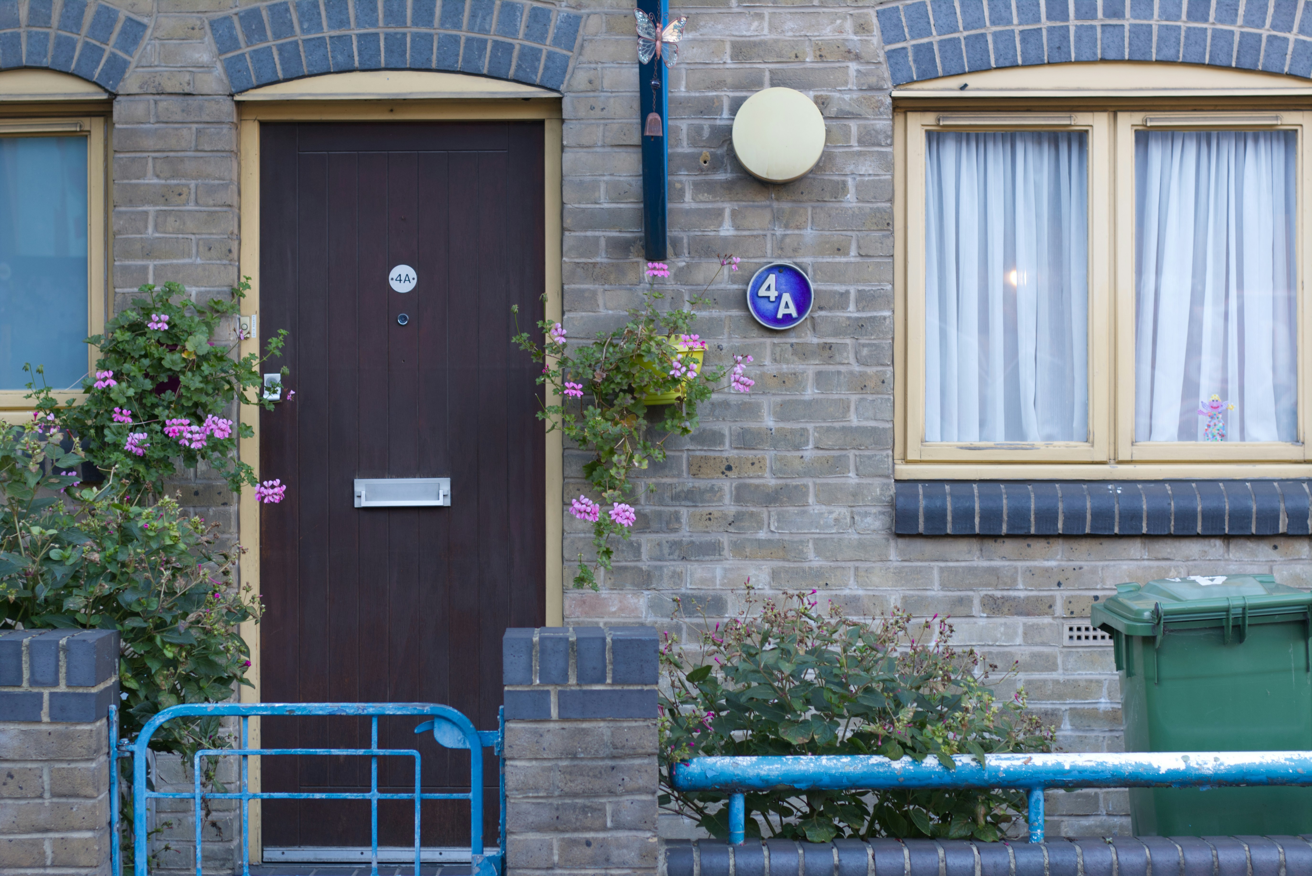Blue Gate, Brick Doorway, and Proud House Number 4A