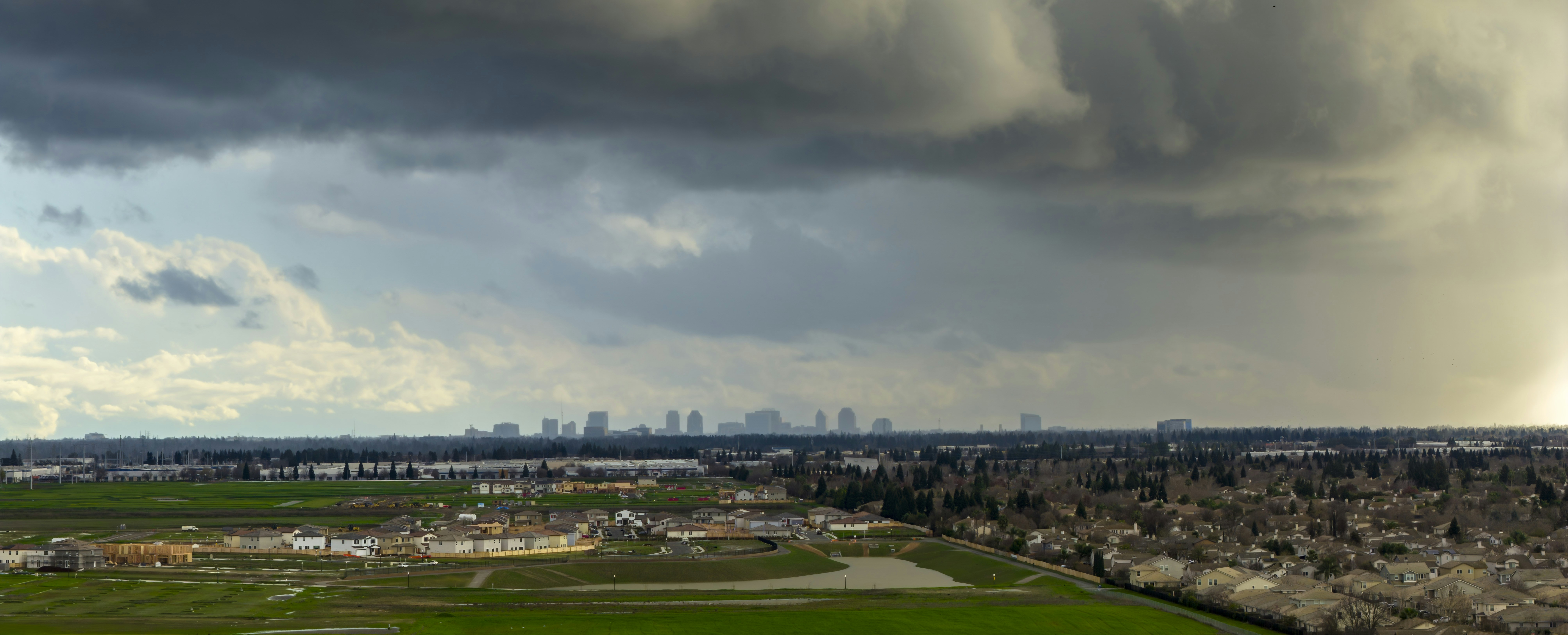 Distant Cityline Beyond a Wide Scrim of Clouds