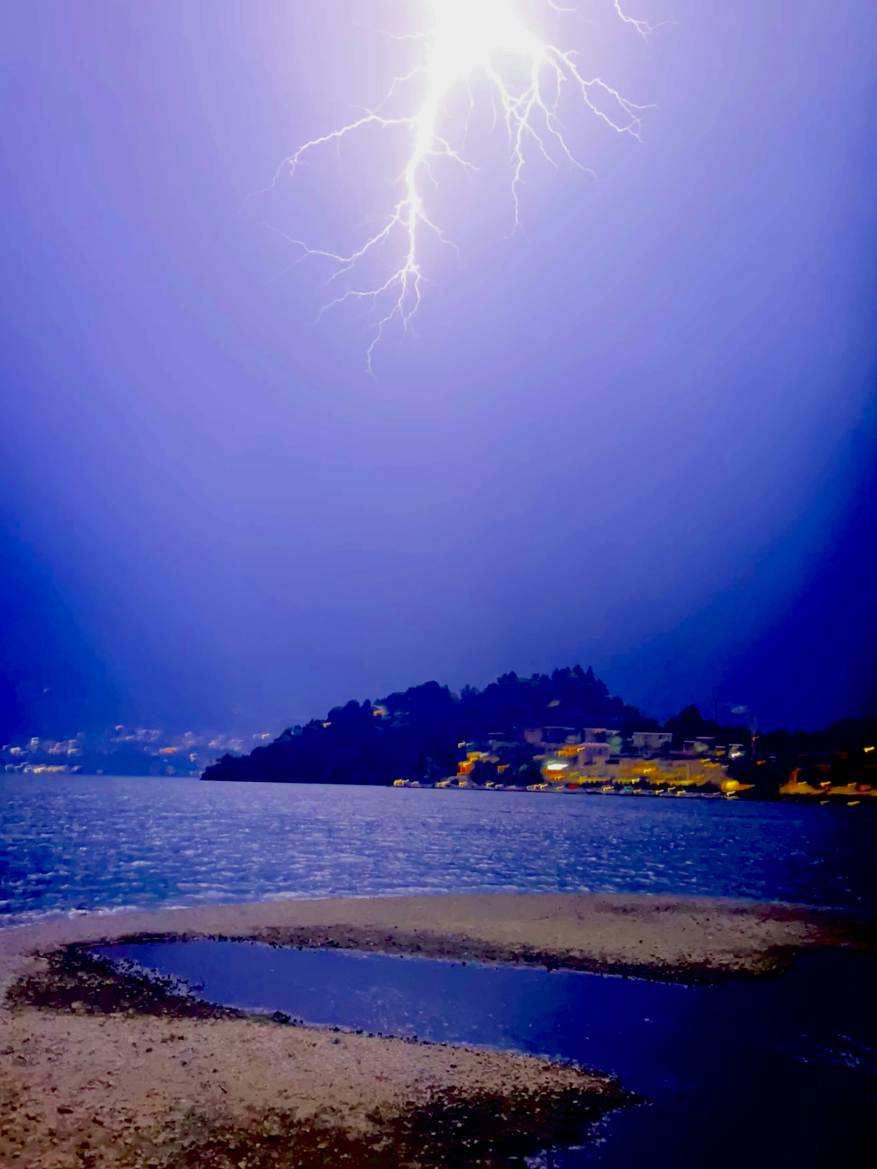 Storm Edge: Lightning over a Night Shore