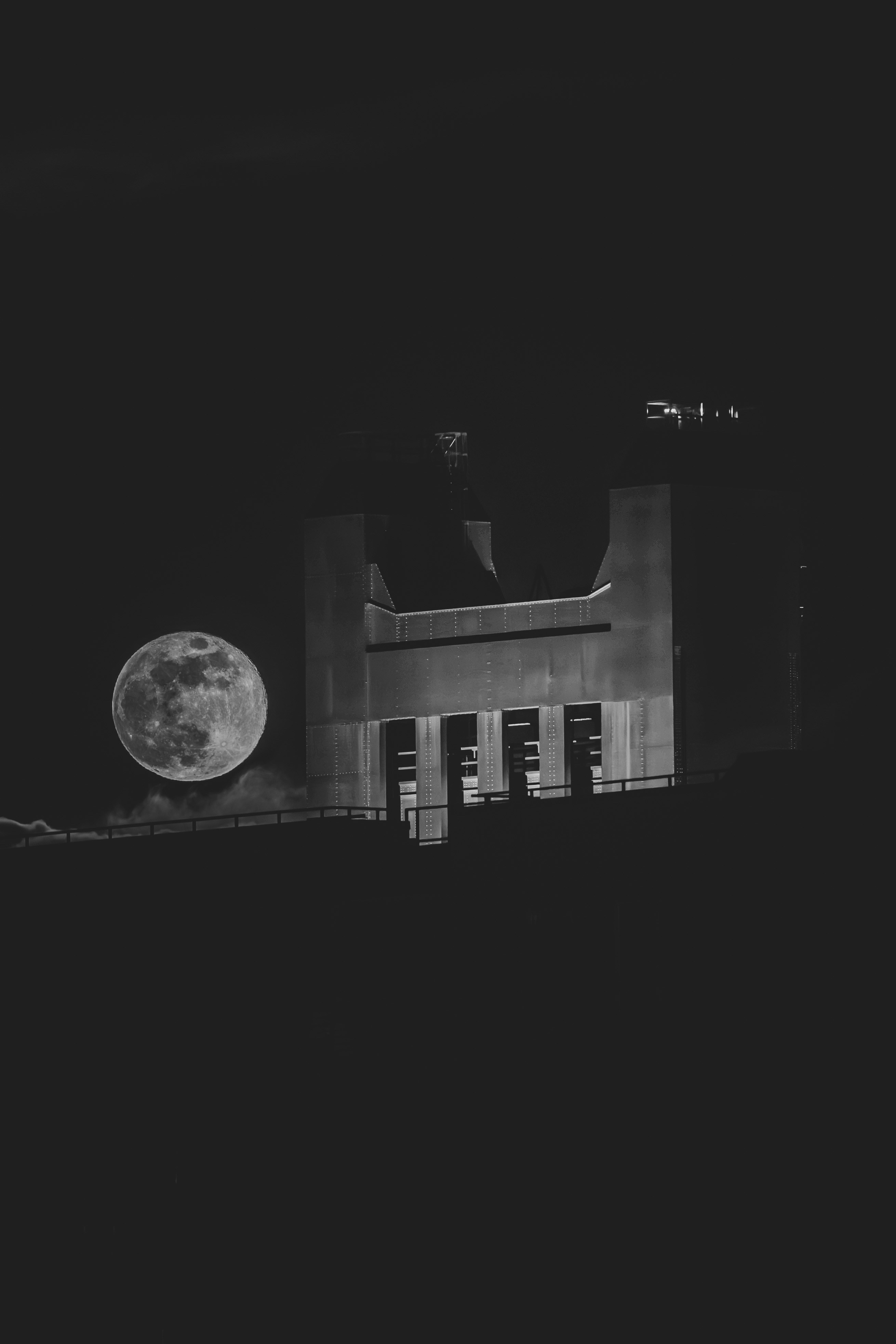 Lunar Rendezvous over the Industrial Facade