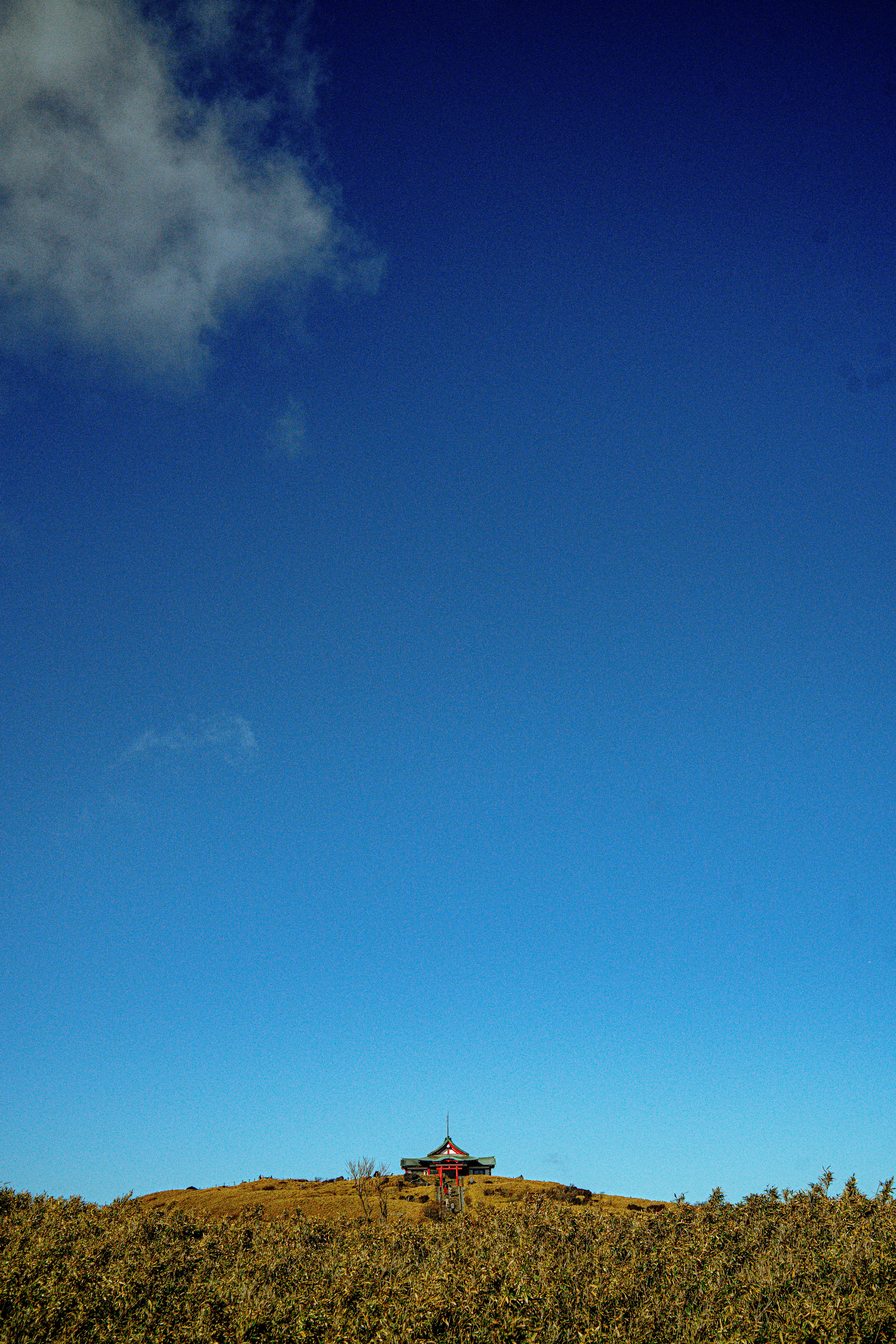 Silent Pagoda on the Hill Under a Wide Blue Sky