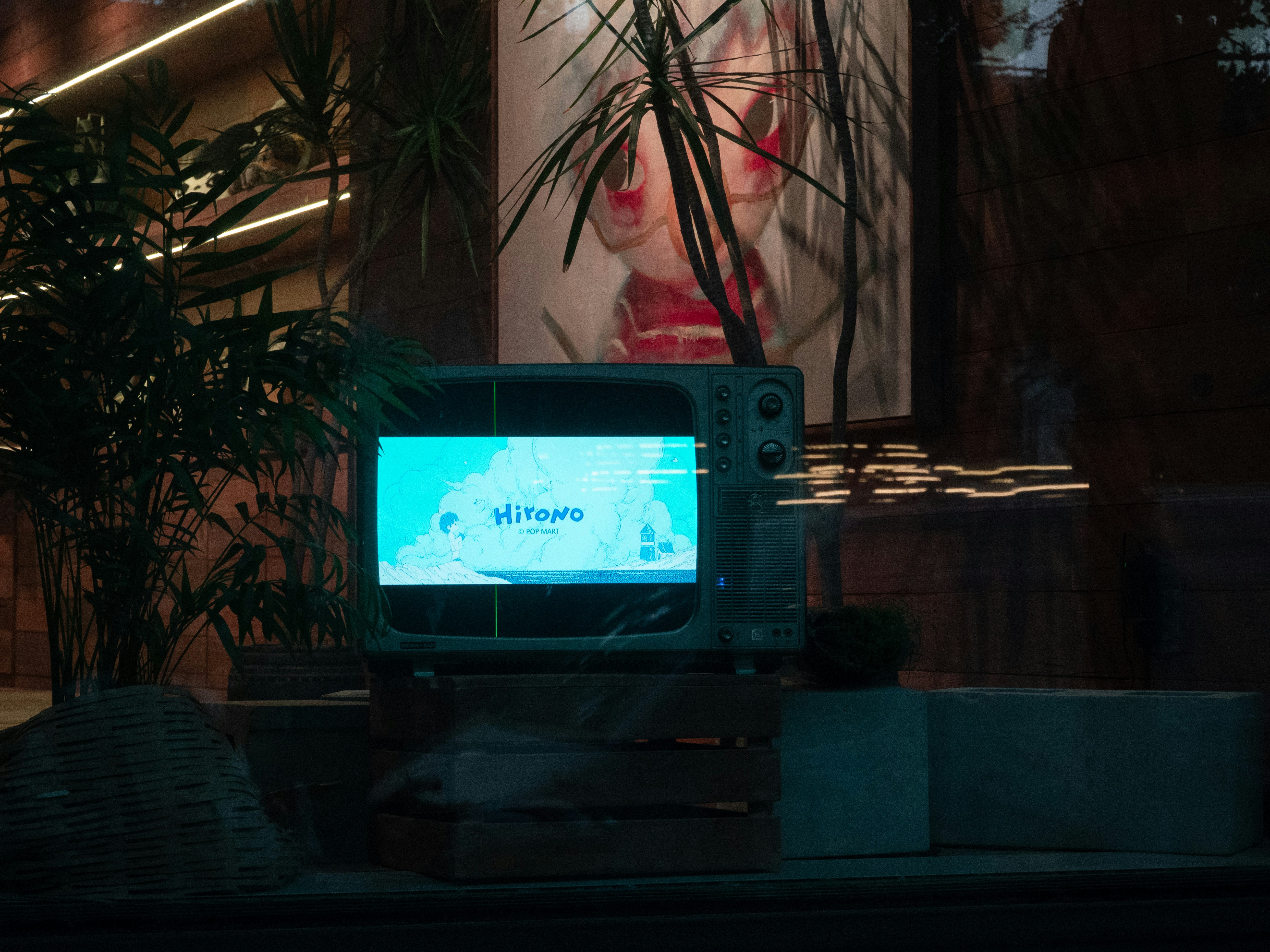 Vintage television displaying a map with green crosshairs.