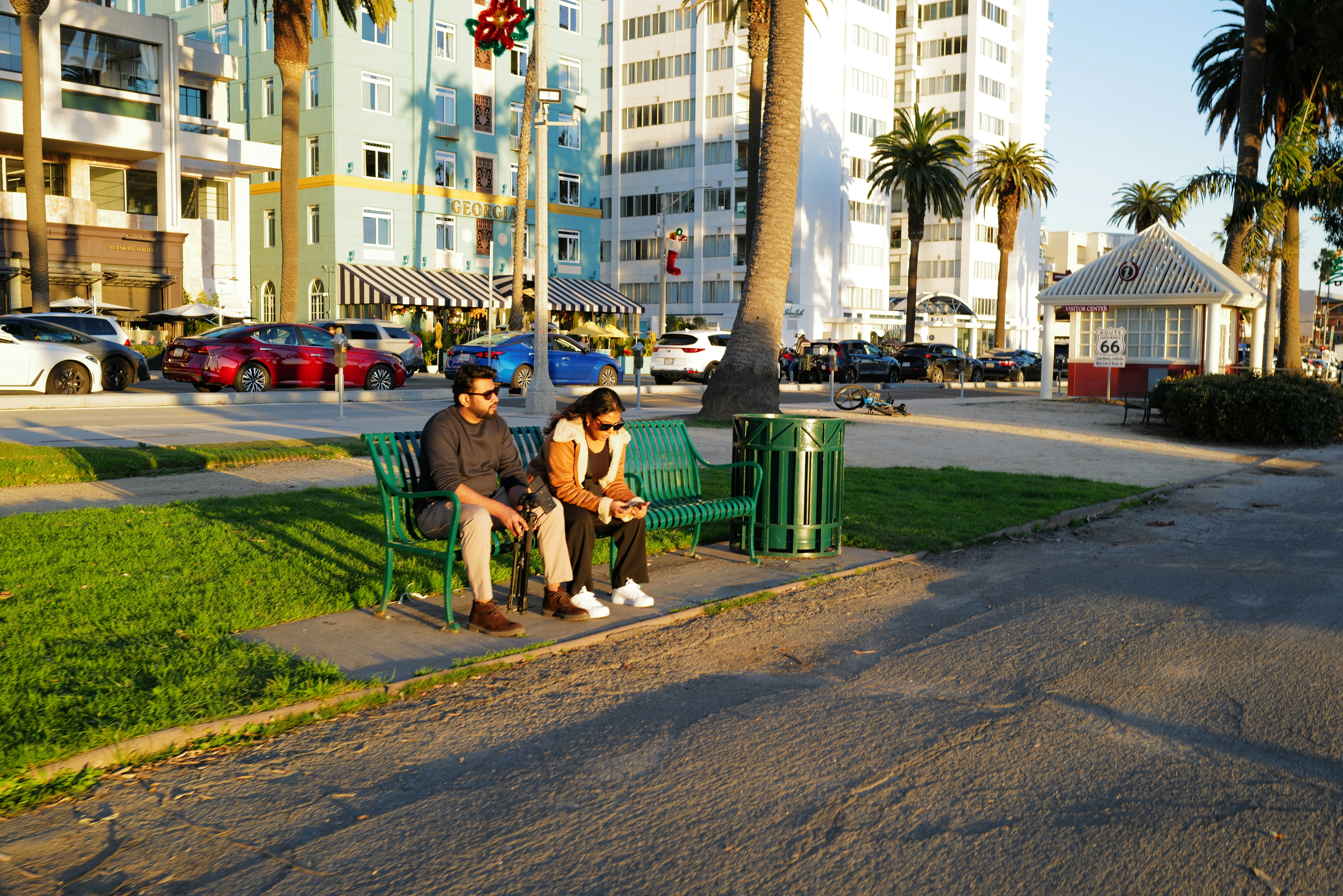 Sunlit Bench Duo by the Seaside Road