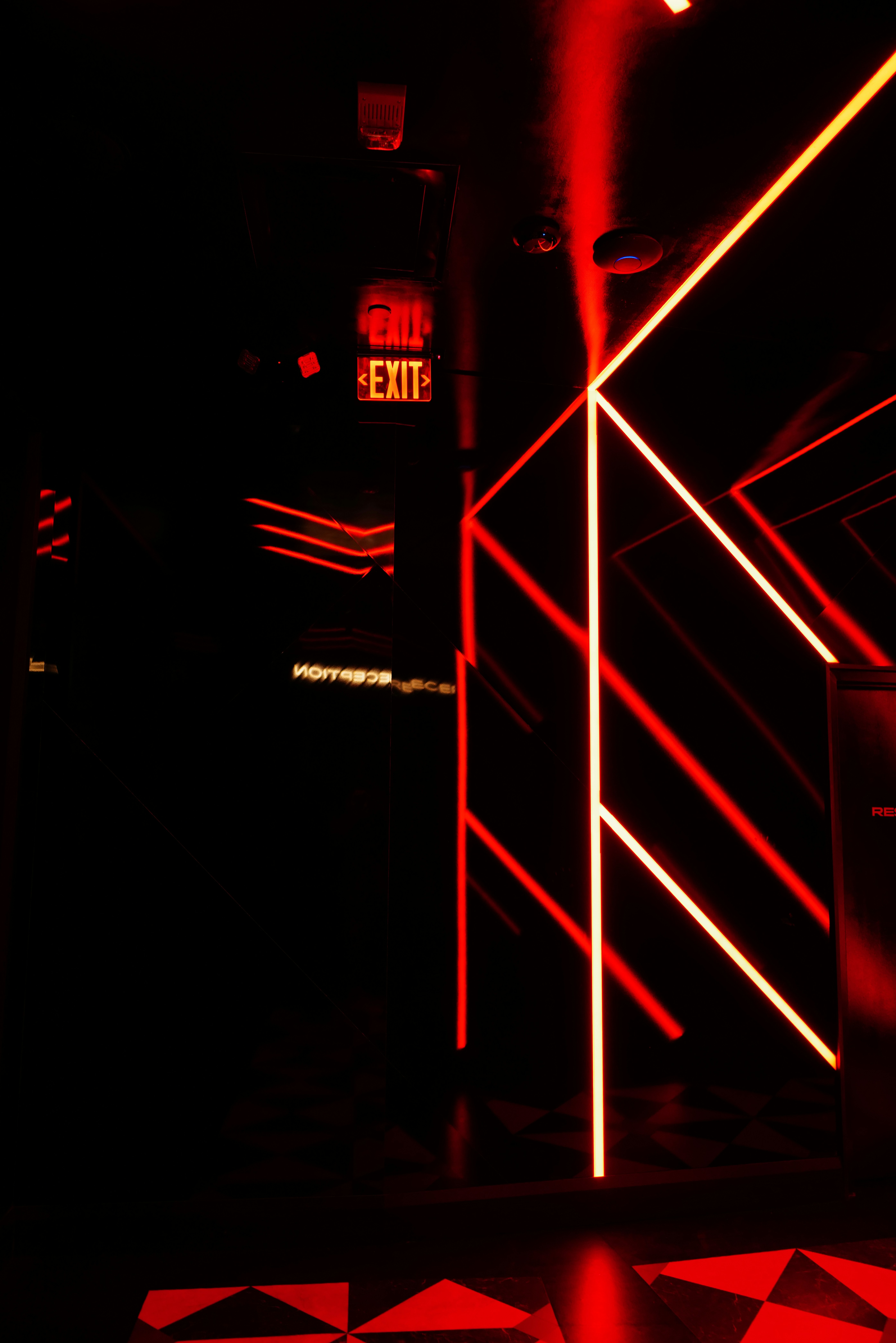 Neon Geometry in a Dark Hallway