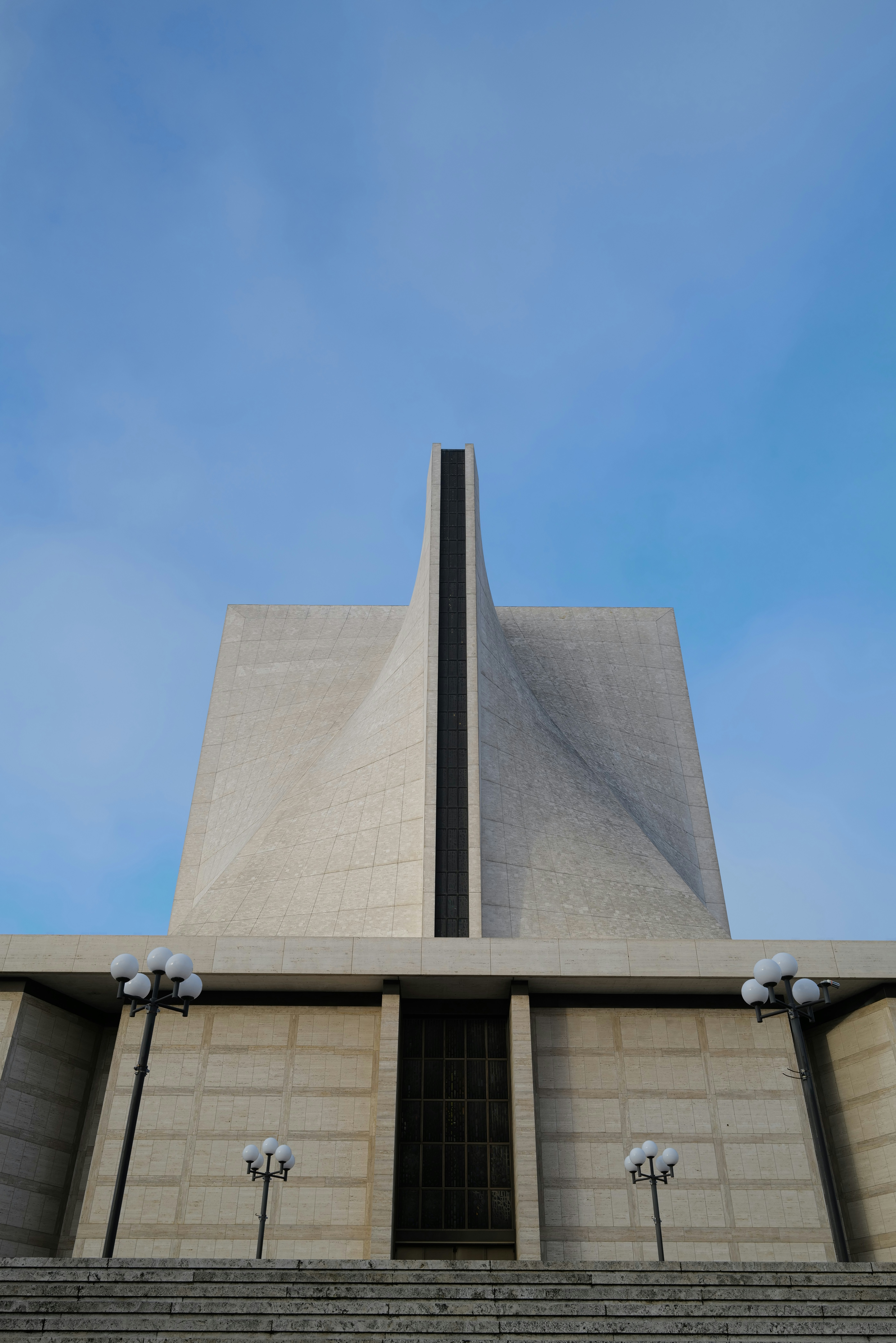 Monolithic Cathedral: A Modernist Facade Reaching Toward the Sky