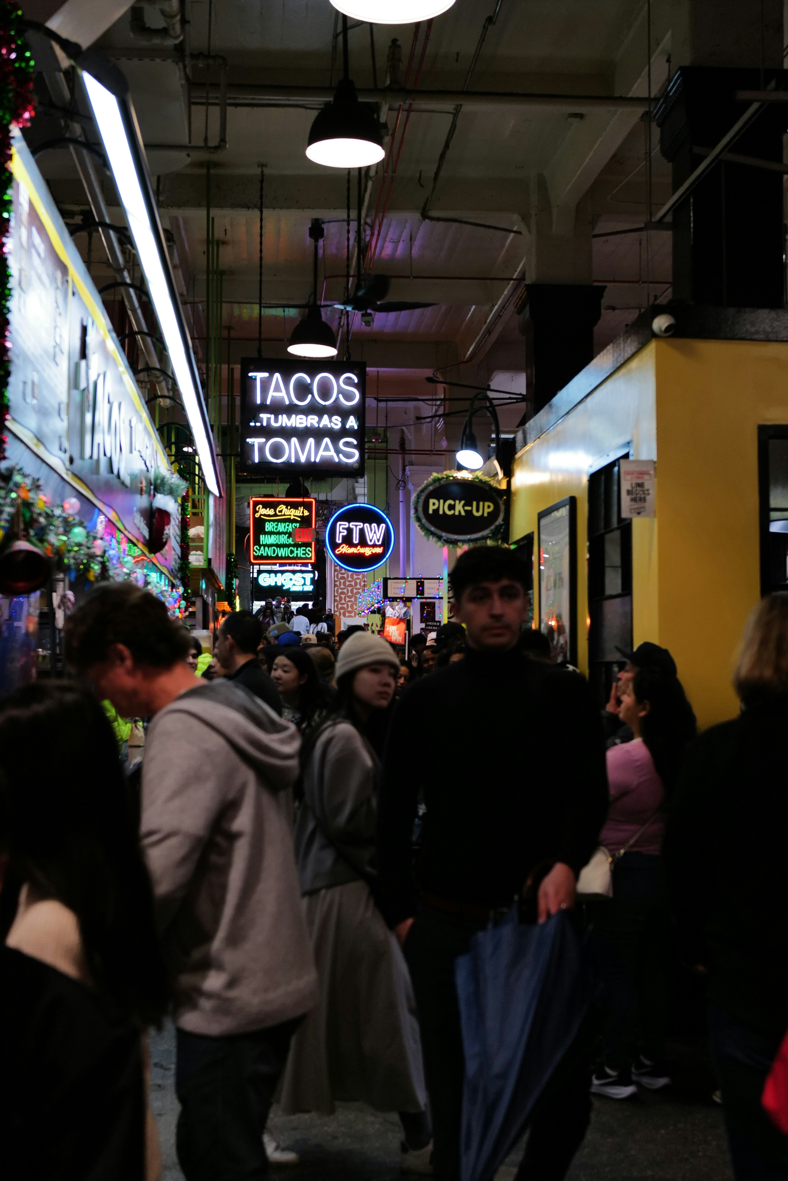 Neon Alley of Flavors: Crowd and Tacos Glow in a Busy Market Night