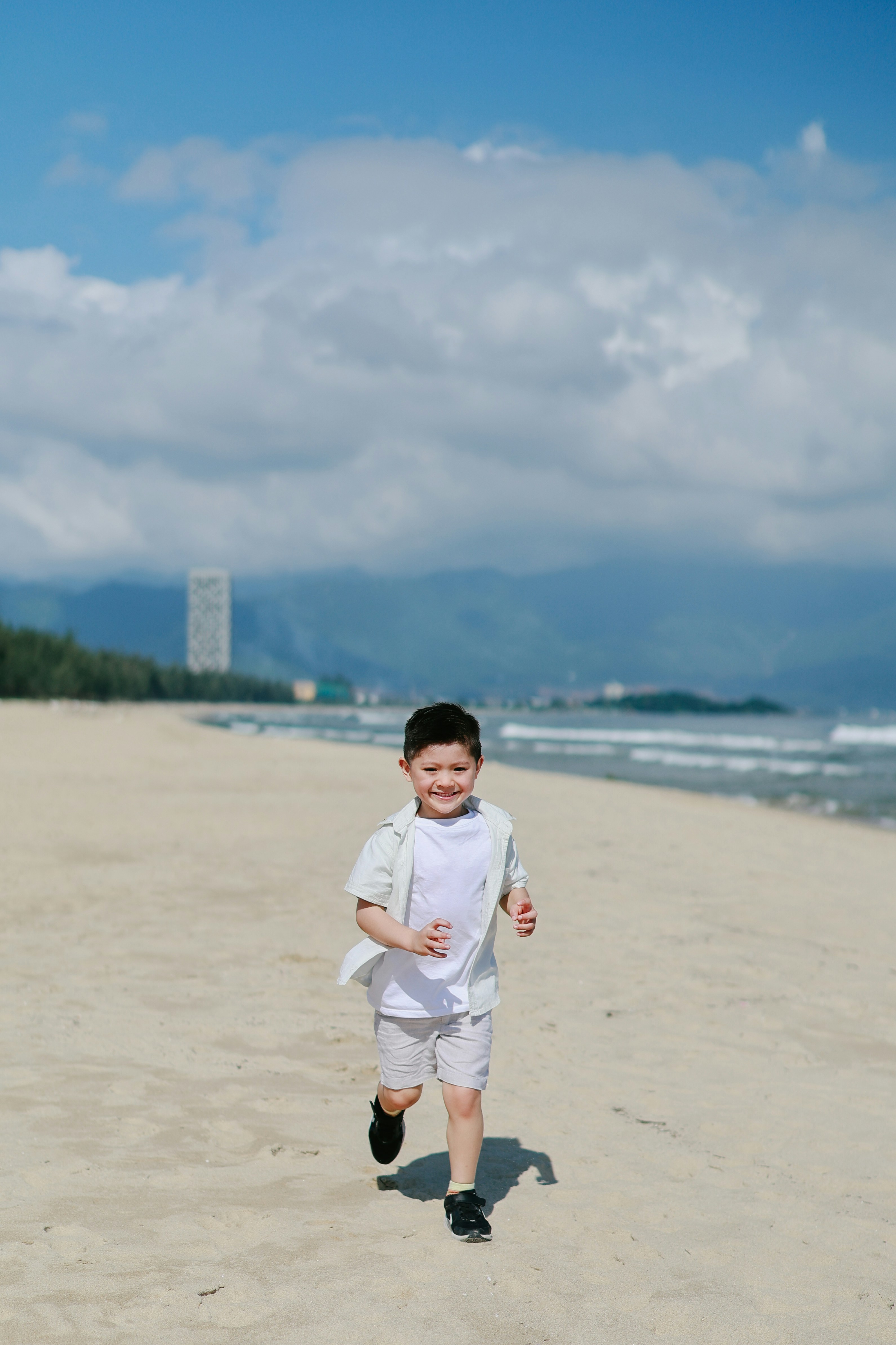 Joyful dash on sunlit sand with the sea breeze