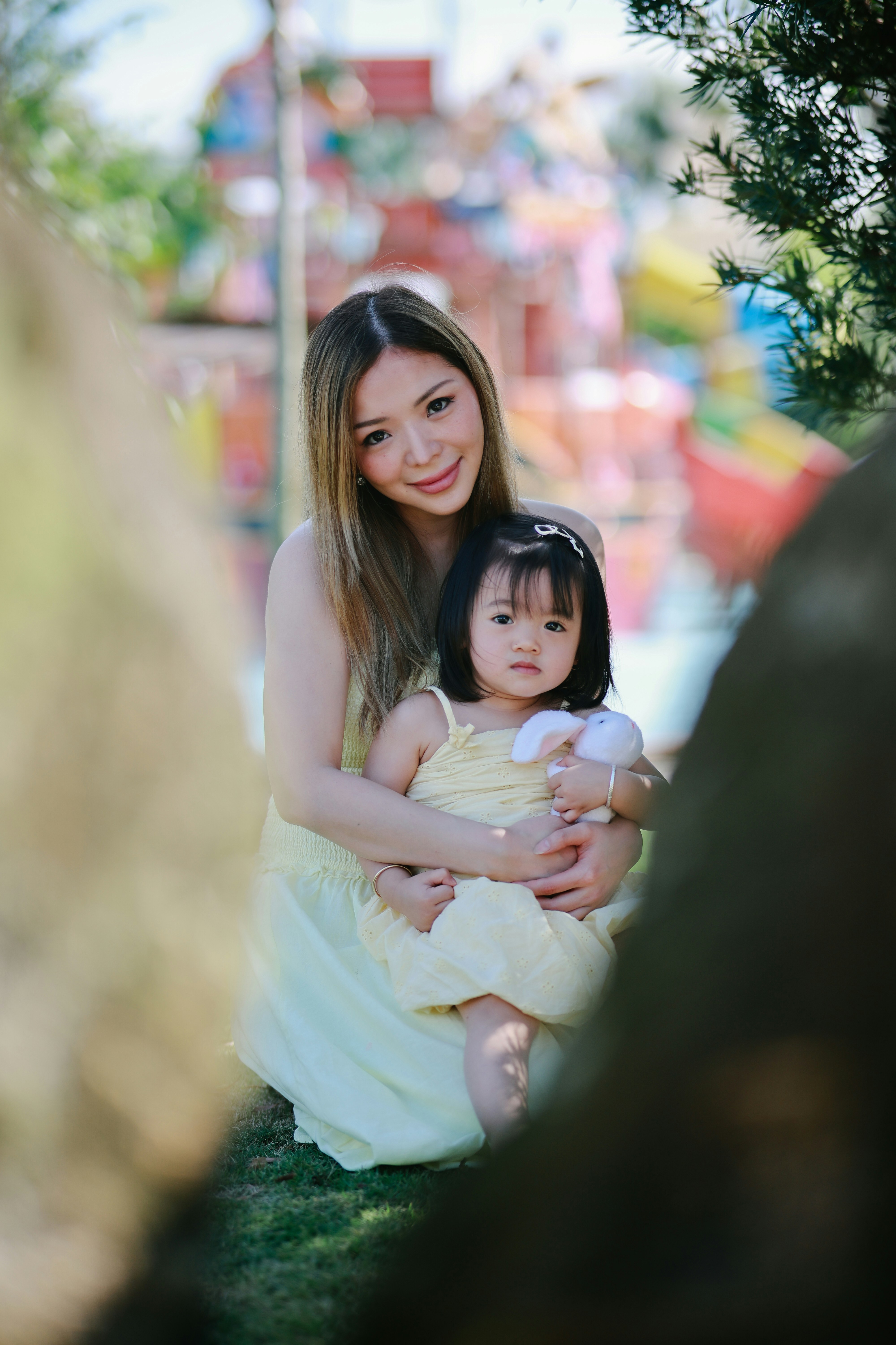 Mother and child glow in soft park light