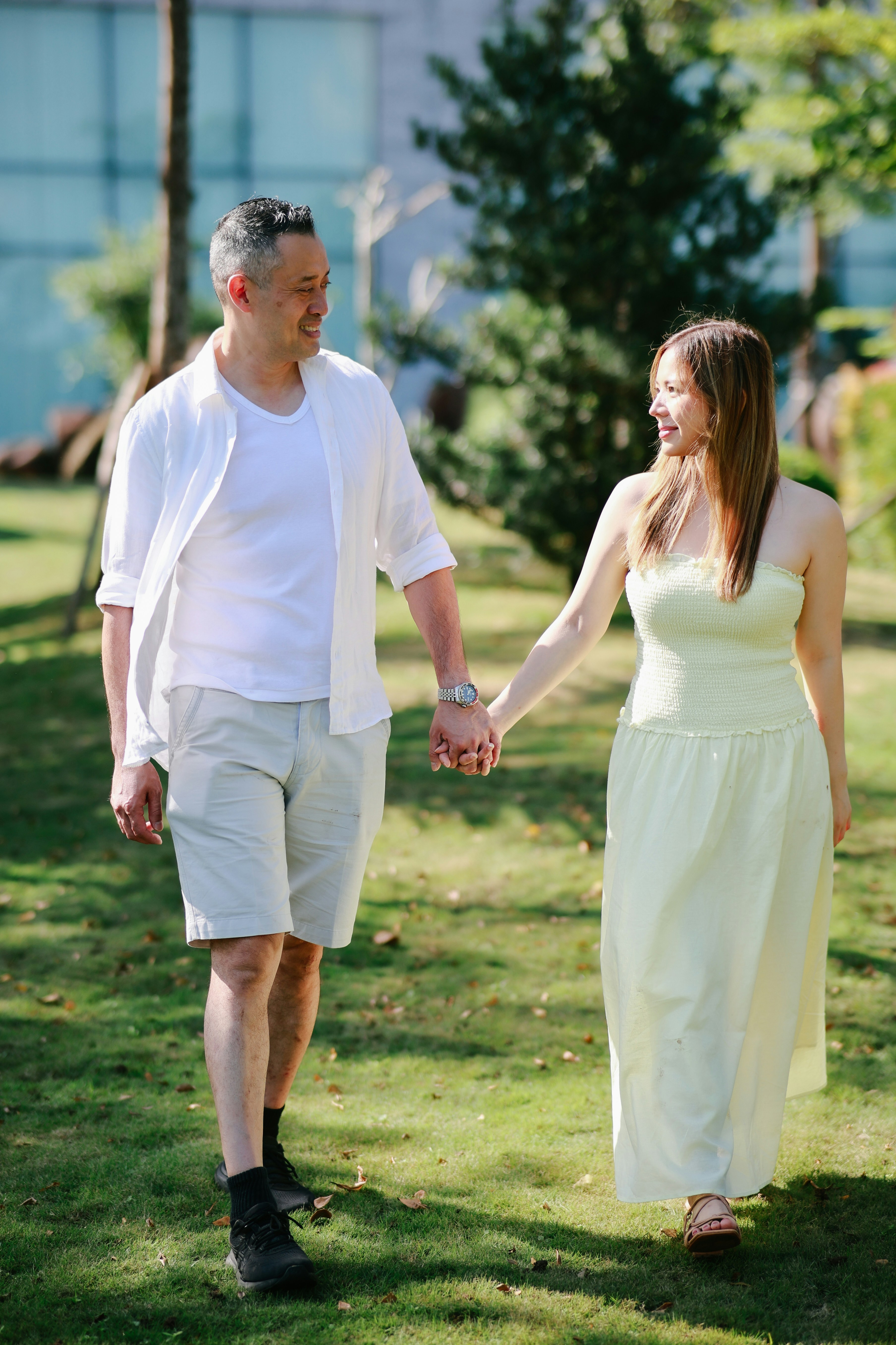 Holding Hands Under Sunlit Sky