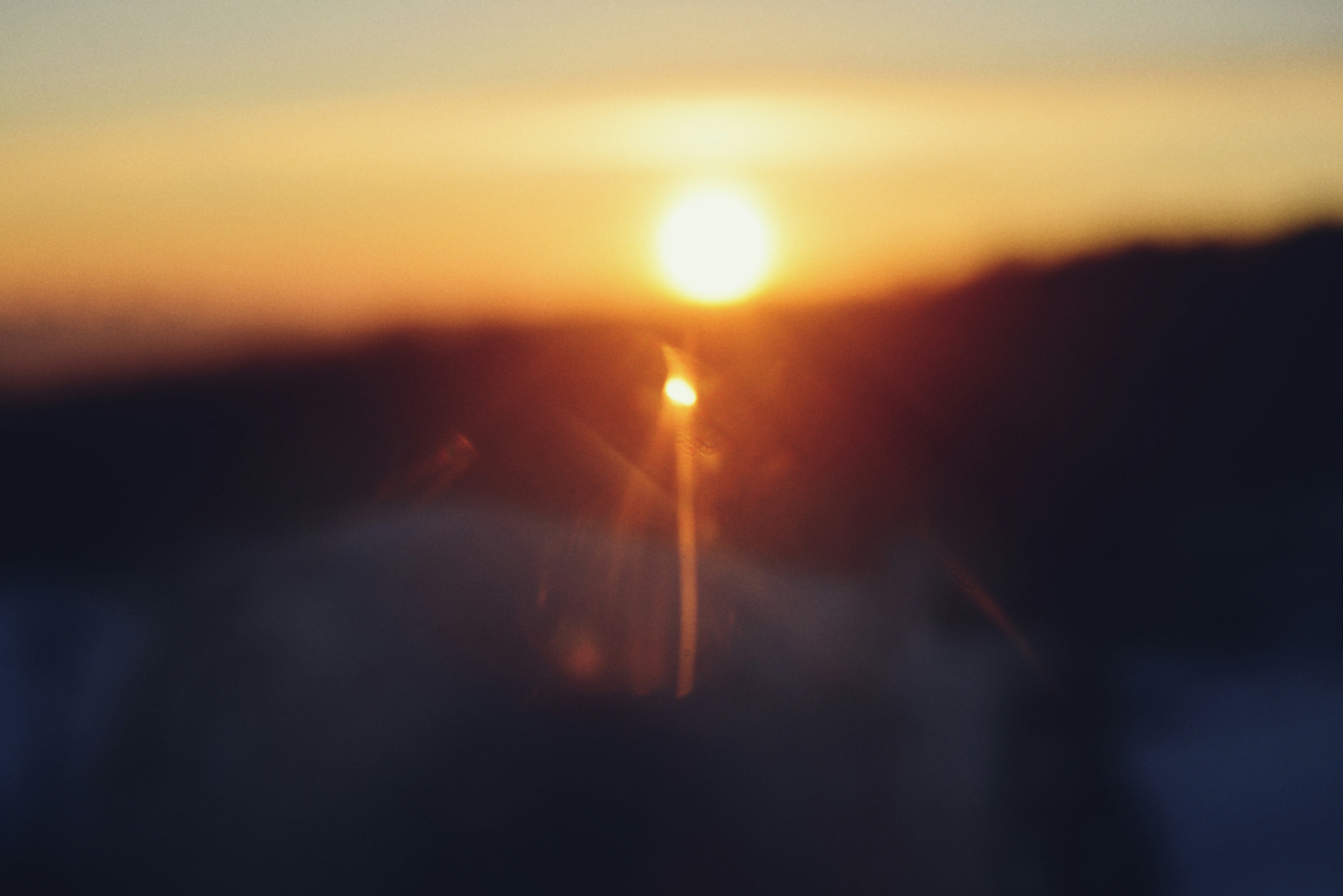 Blurred Horizon: A Sunlit Mirage Through Frosted Glass