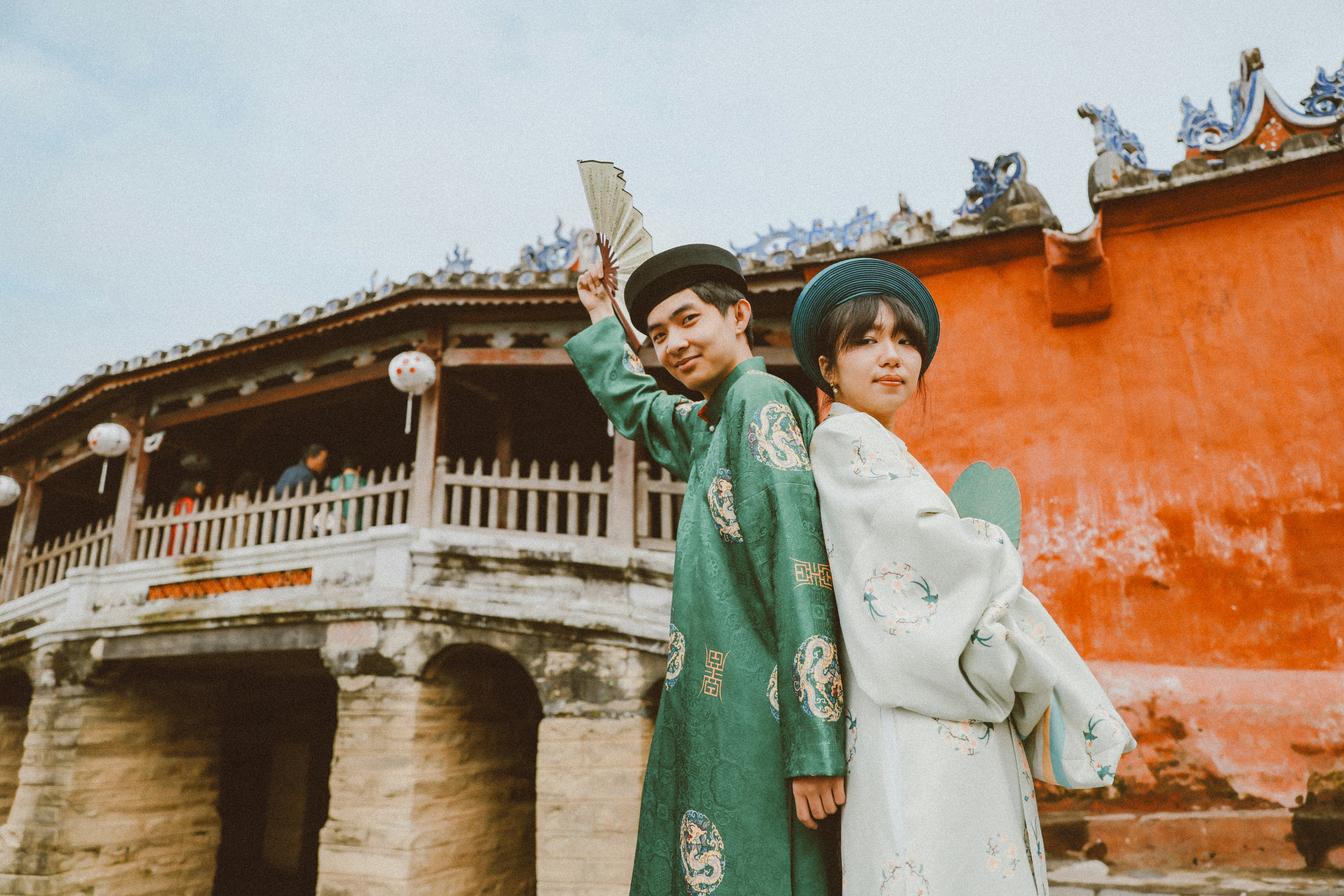 Two Painted Echoes: Traditional Attire at a Historic Terrace
