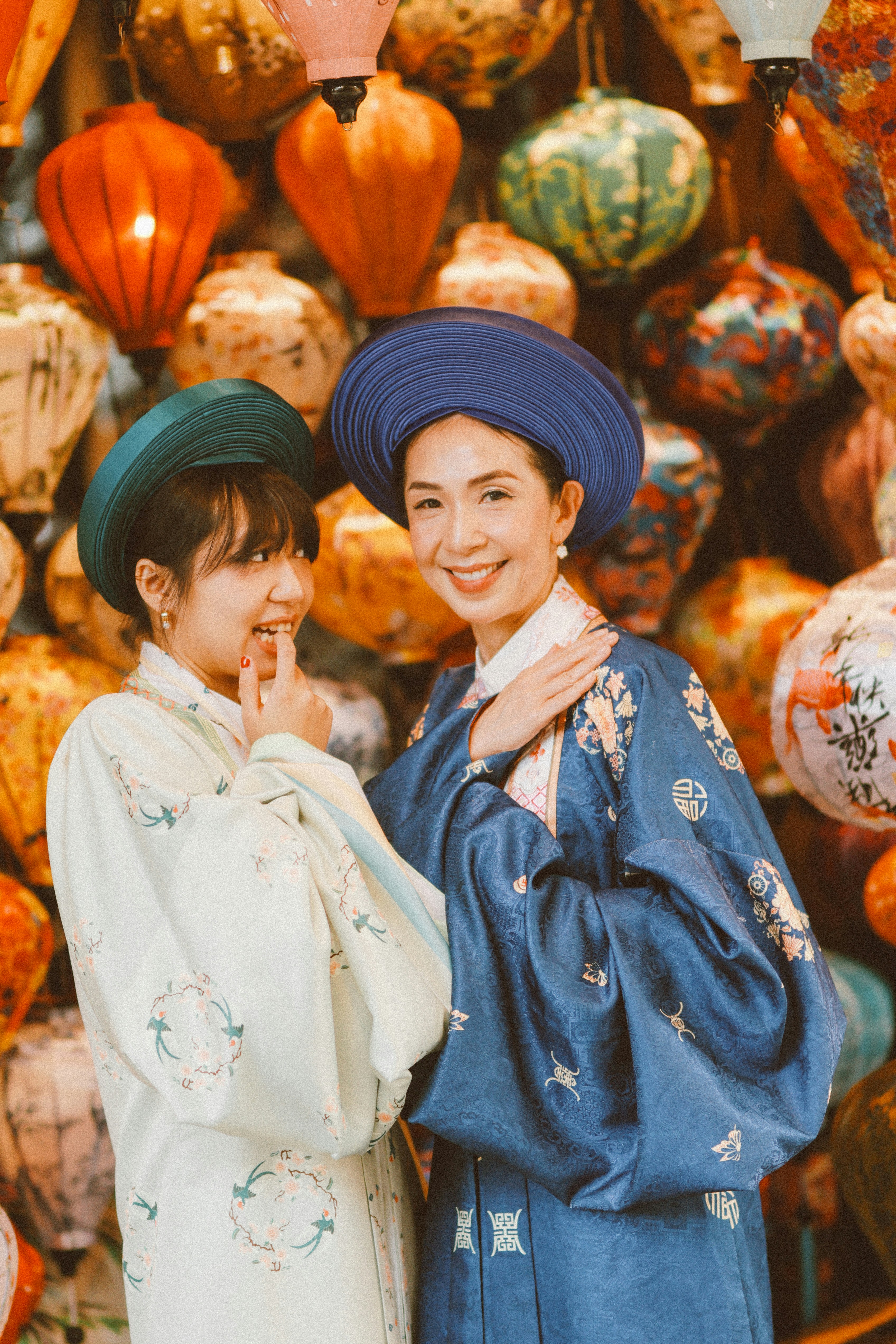 Blue and Teal Robes Among Lanterns: A Moment in a Colorful Night Market