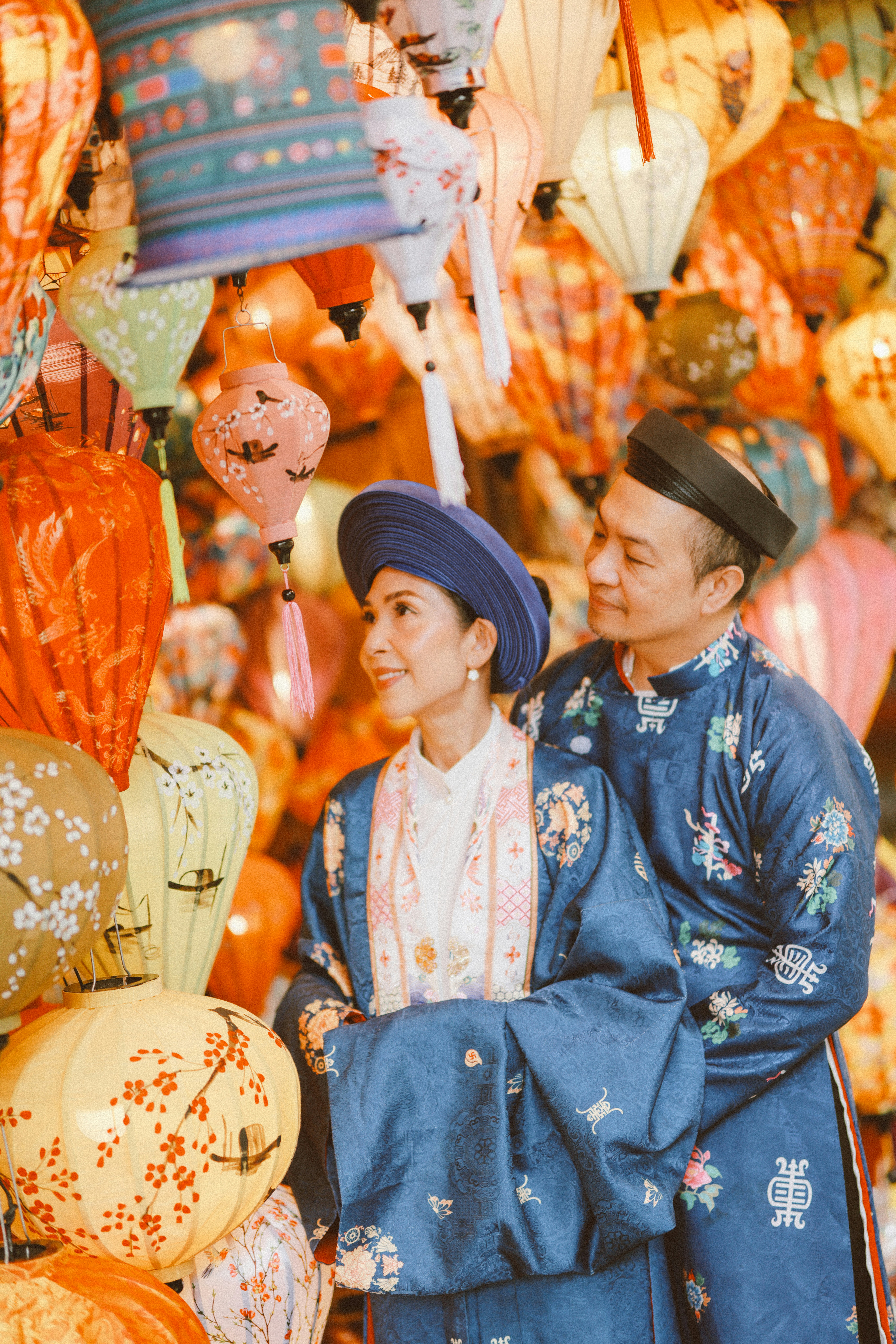 Blue Robes Among Lanterns: A Moment of Quiet Amid Festive Glow