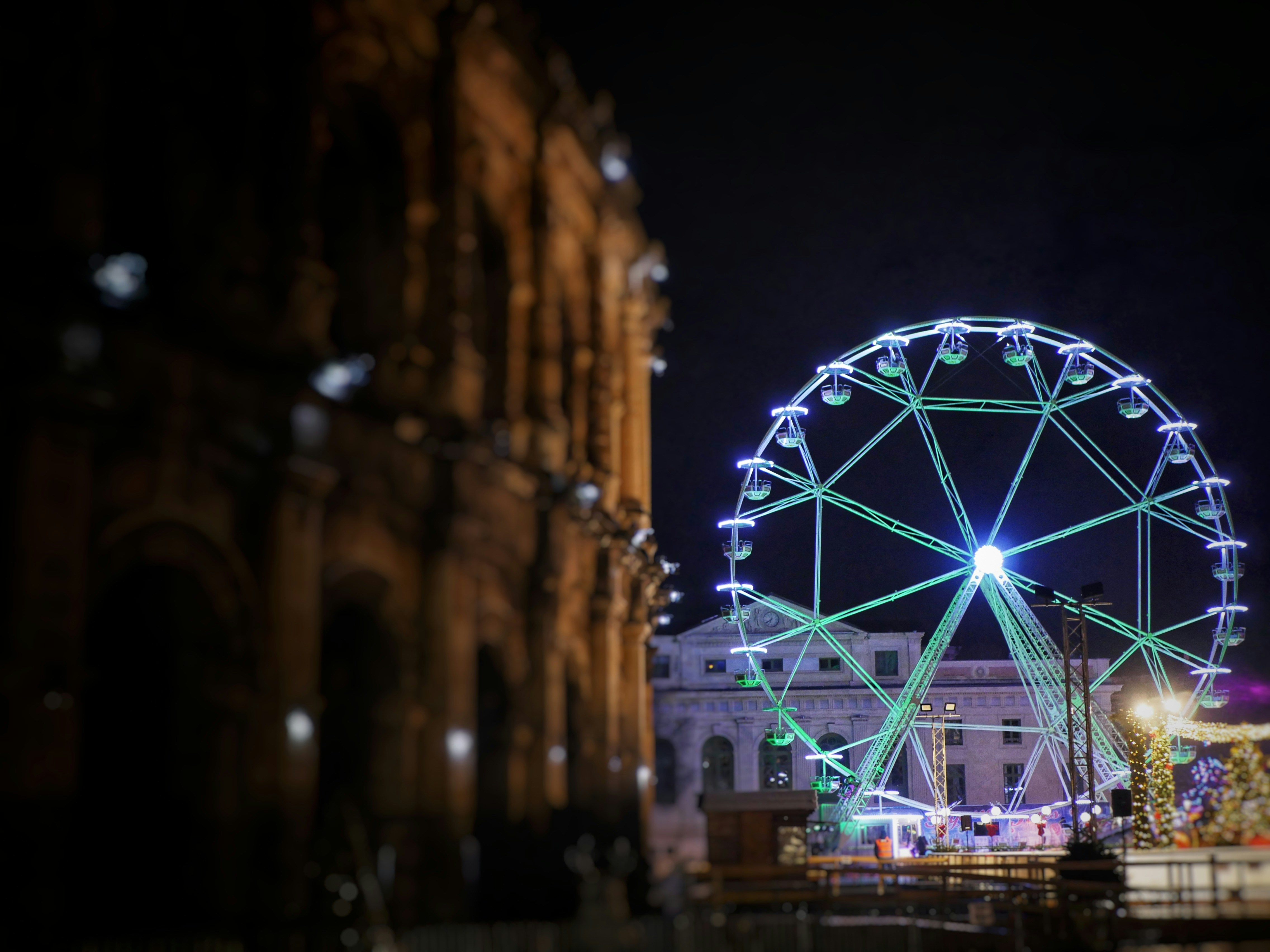 Nighttime Ferris Wheel Lanterns Over the Paved Square
