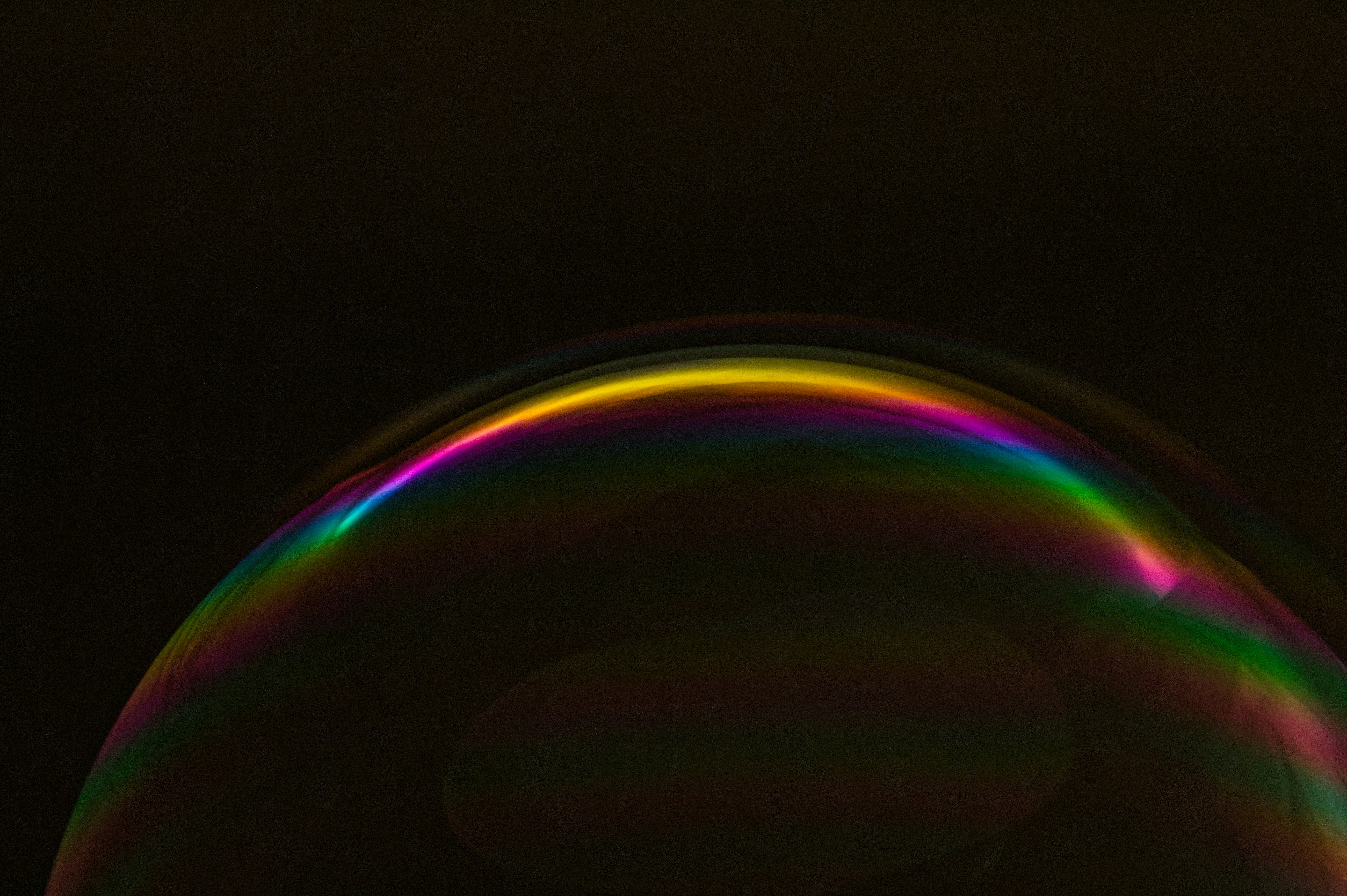 Close-up of a rainbow-colored bubble on black background photo – Free ...