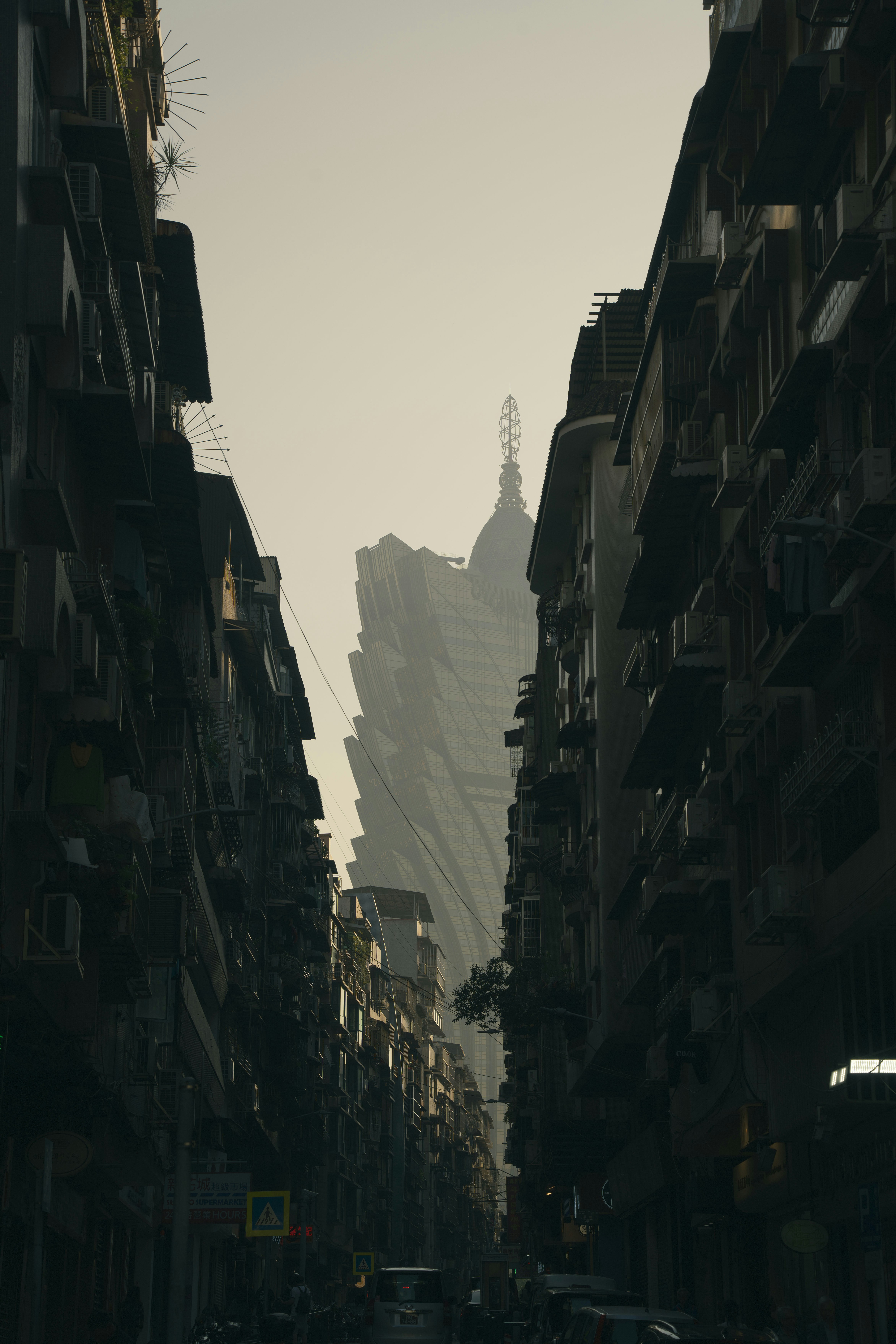 Towering silhouette: city canyon with distant spire