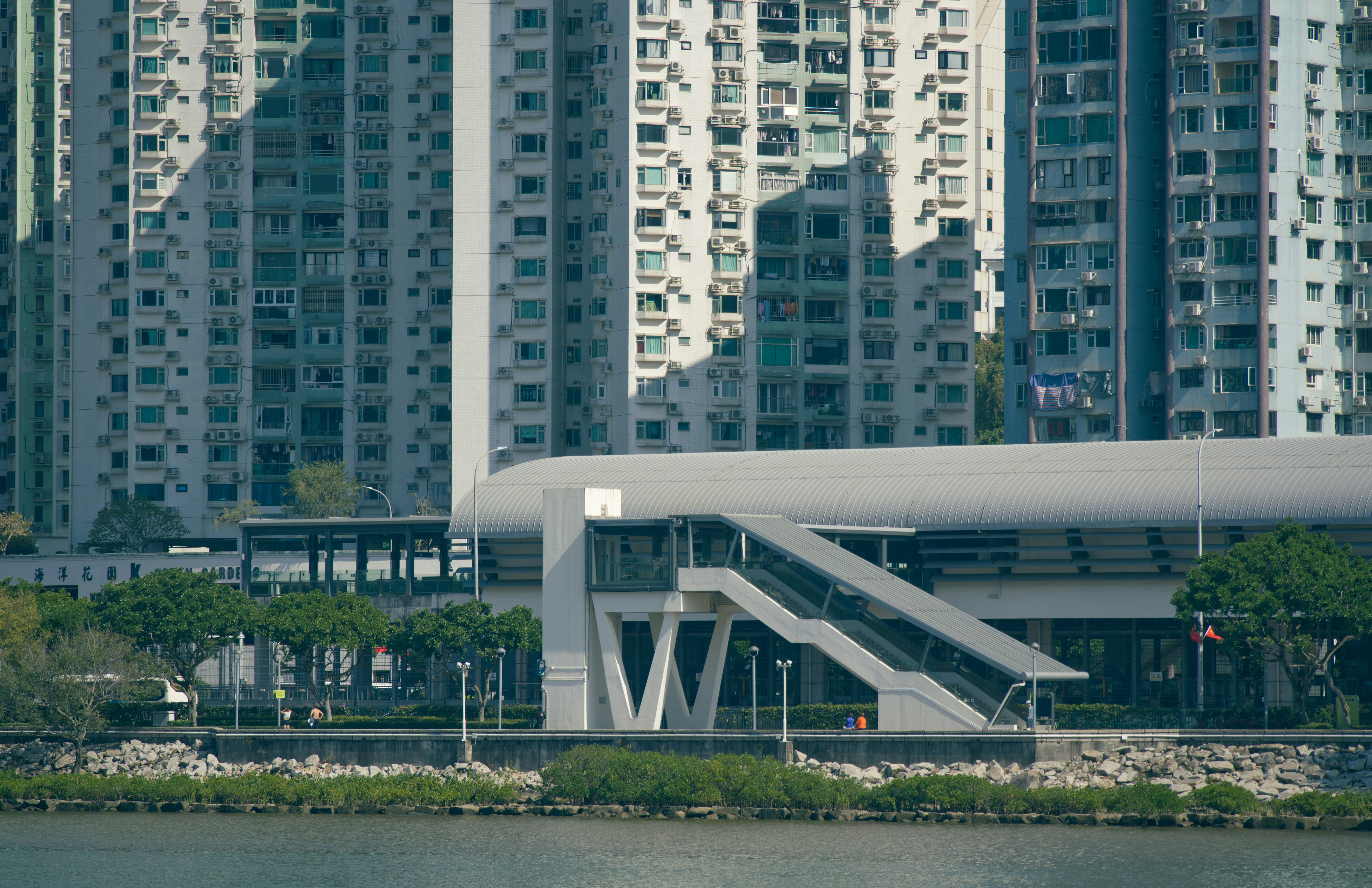 Transit-Orb Staircase Framed by Urban Towers