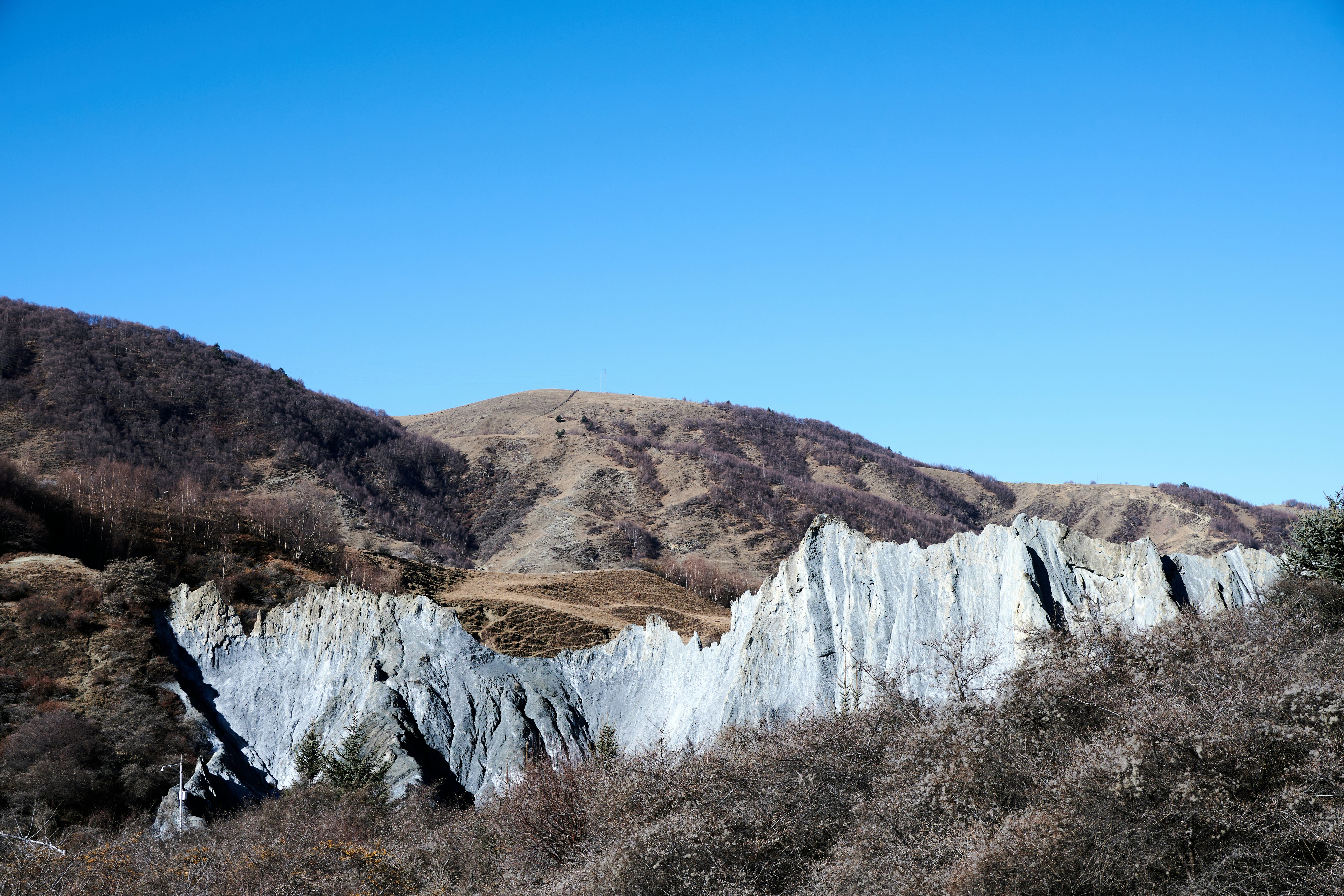 White limestone cliffs under a clear blue sky