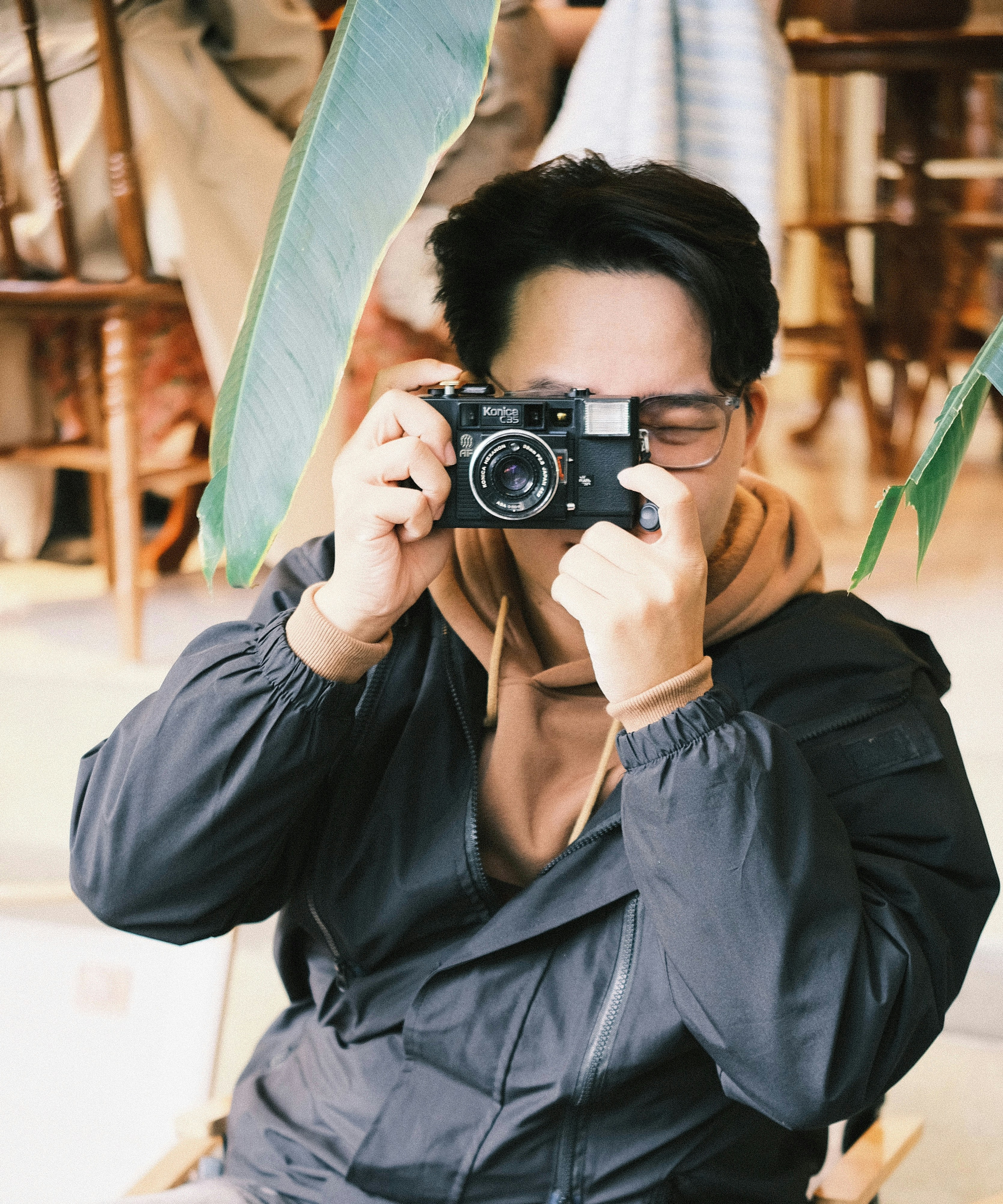 Midair Portrait: A Street Photographer Aiming Through the Lens