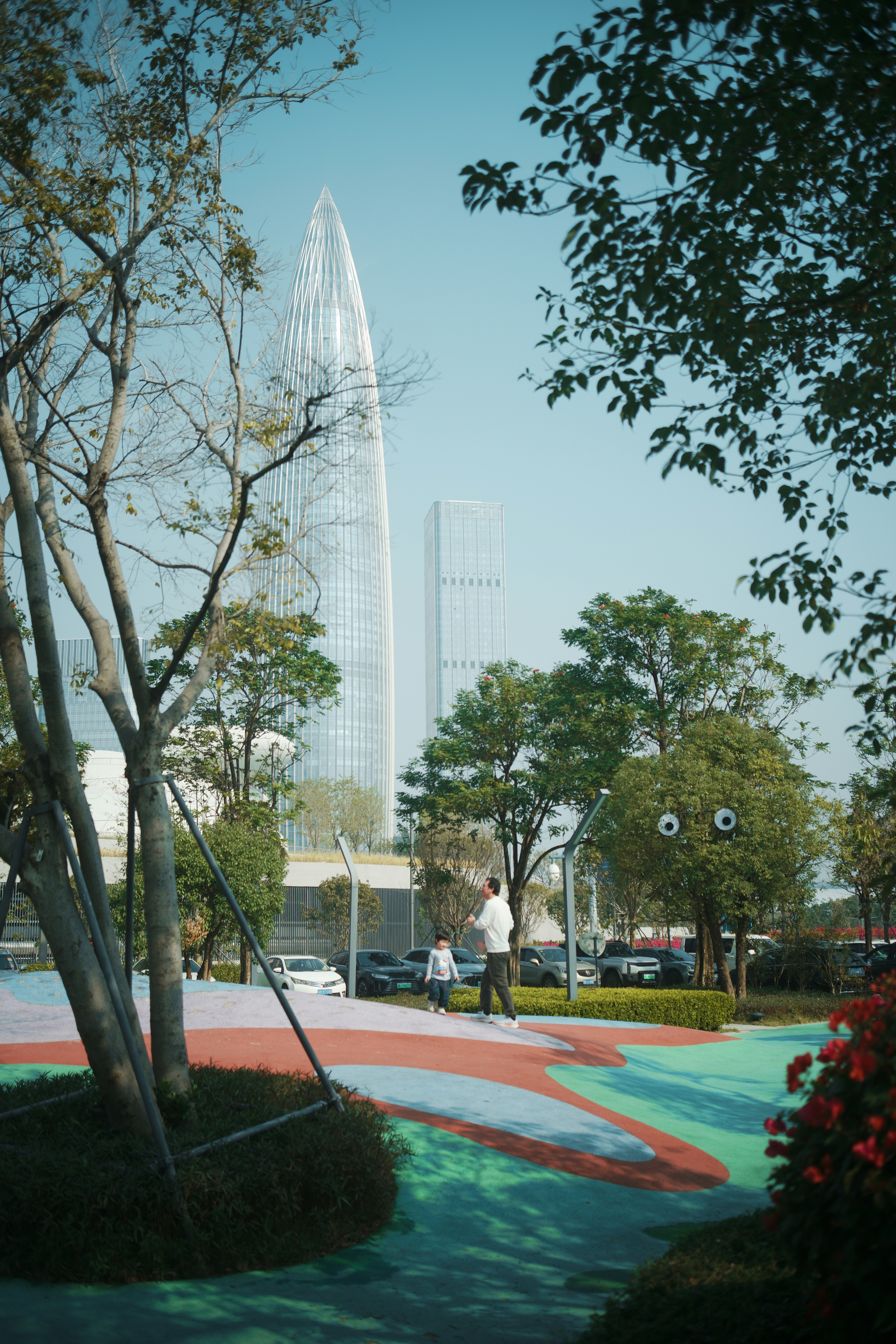 Cityscape Playground: A Sunlit Path through Modern Towers