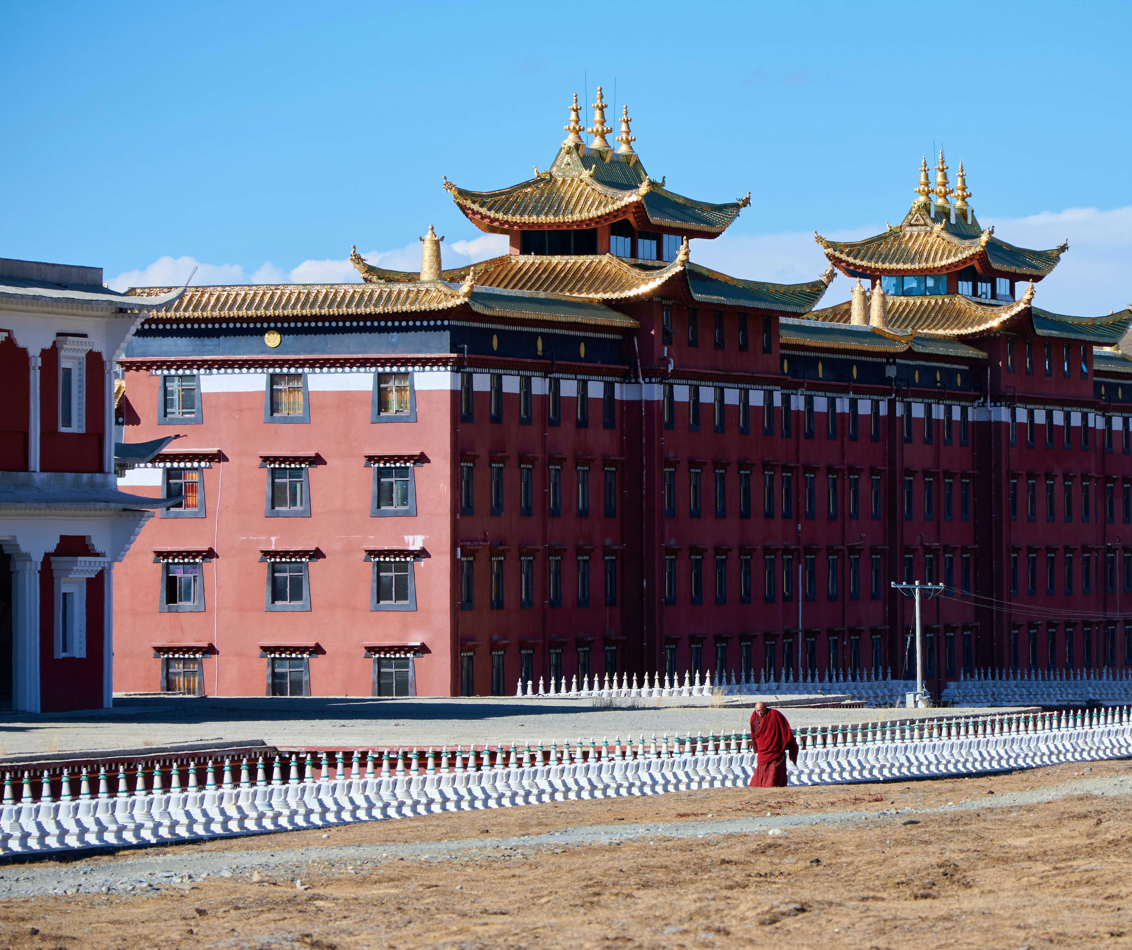 Red Fortress Horizon: A Monk Walks the Balustrade