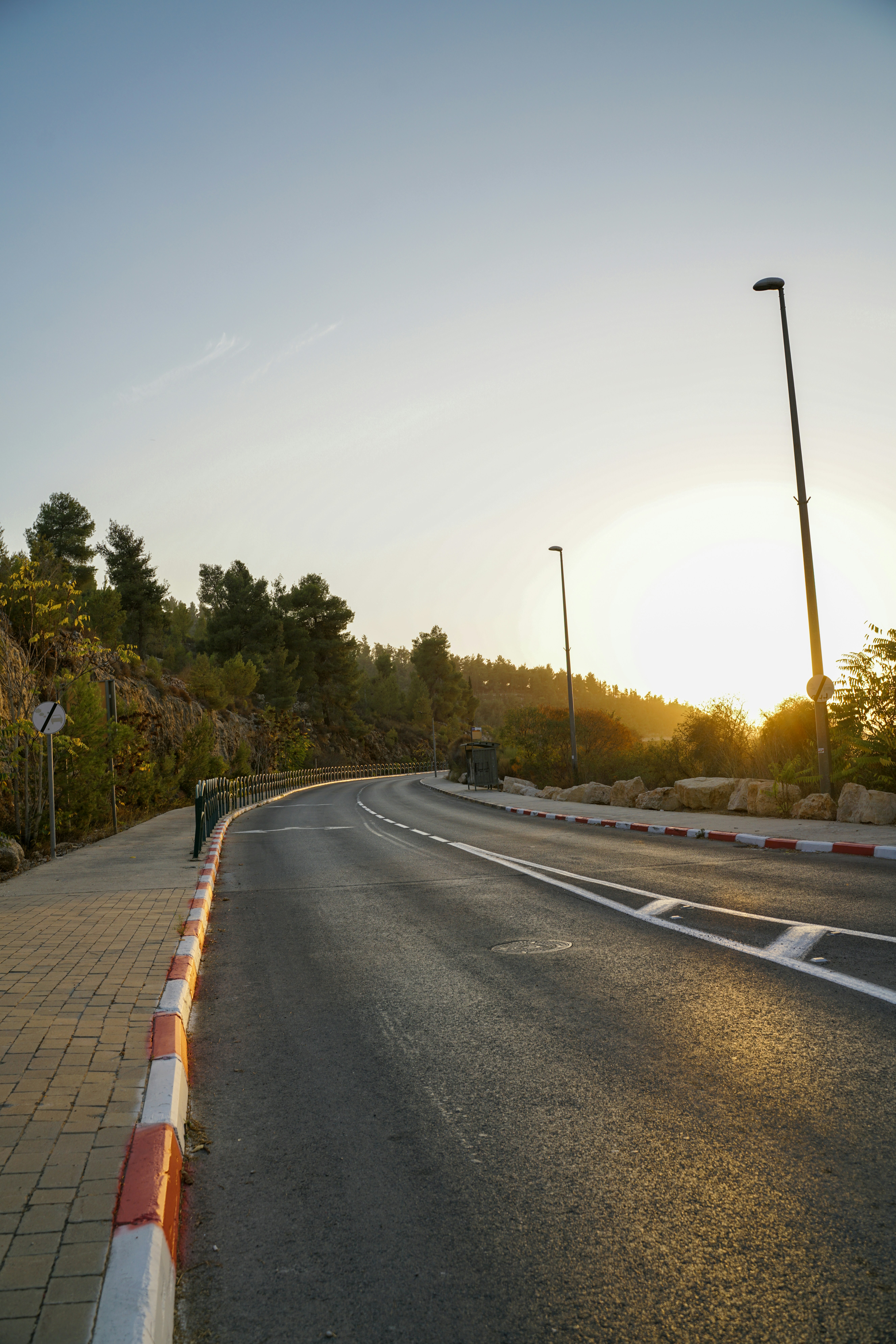 Sunlit Curve: A Quiet coastal road Bending Toward the Horizon