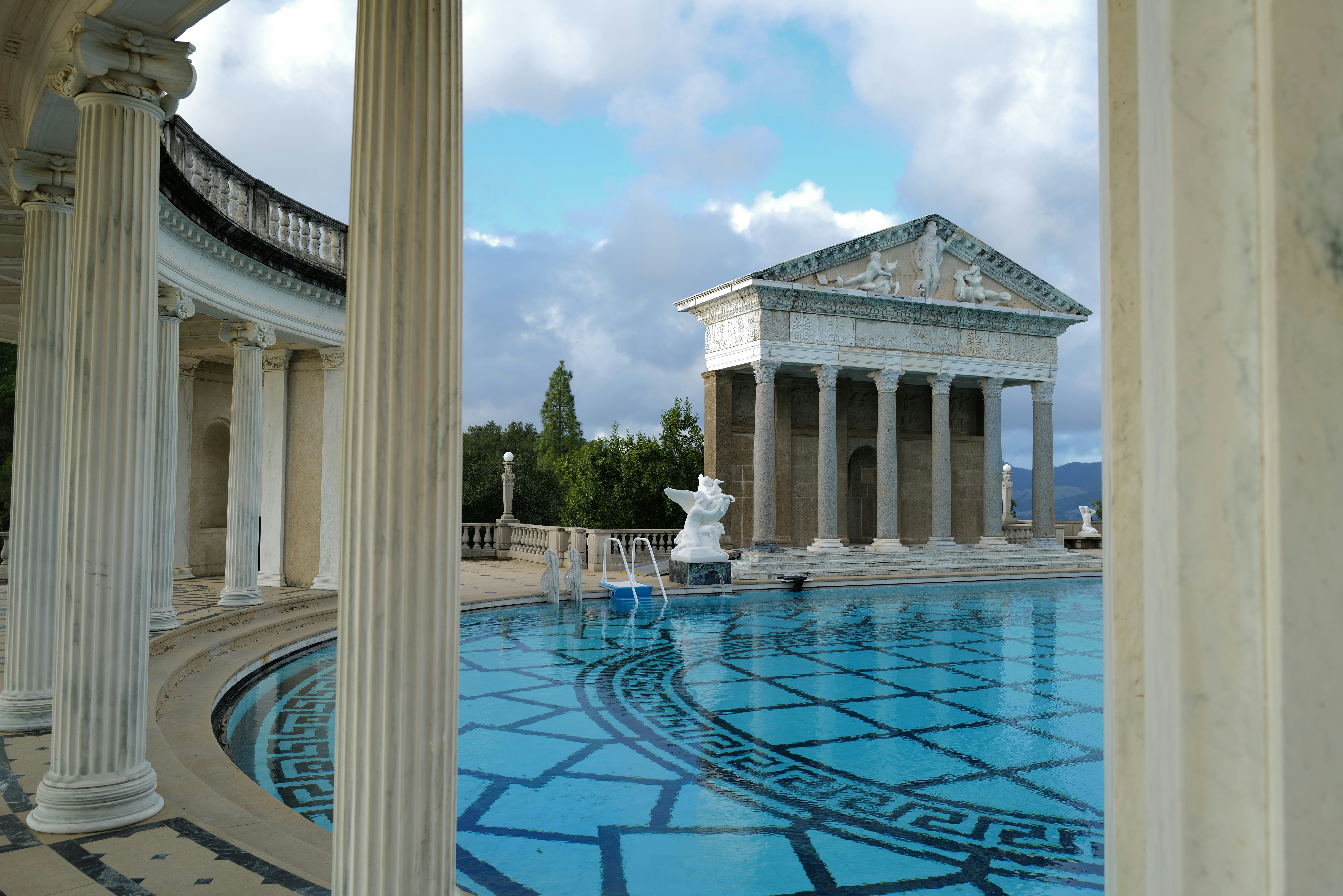 Temple by the Pool: Classical Columns Framing an Utopian Terrace