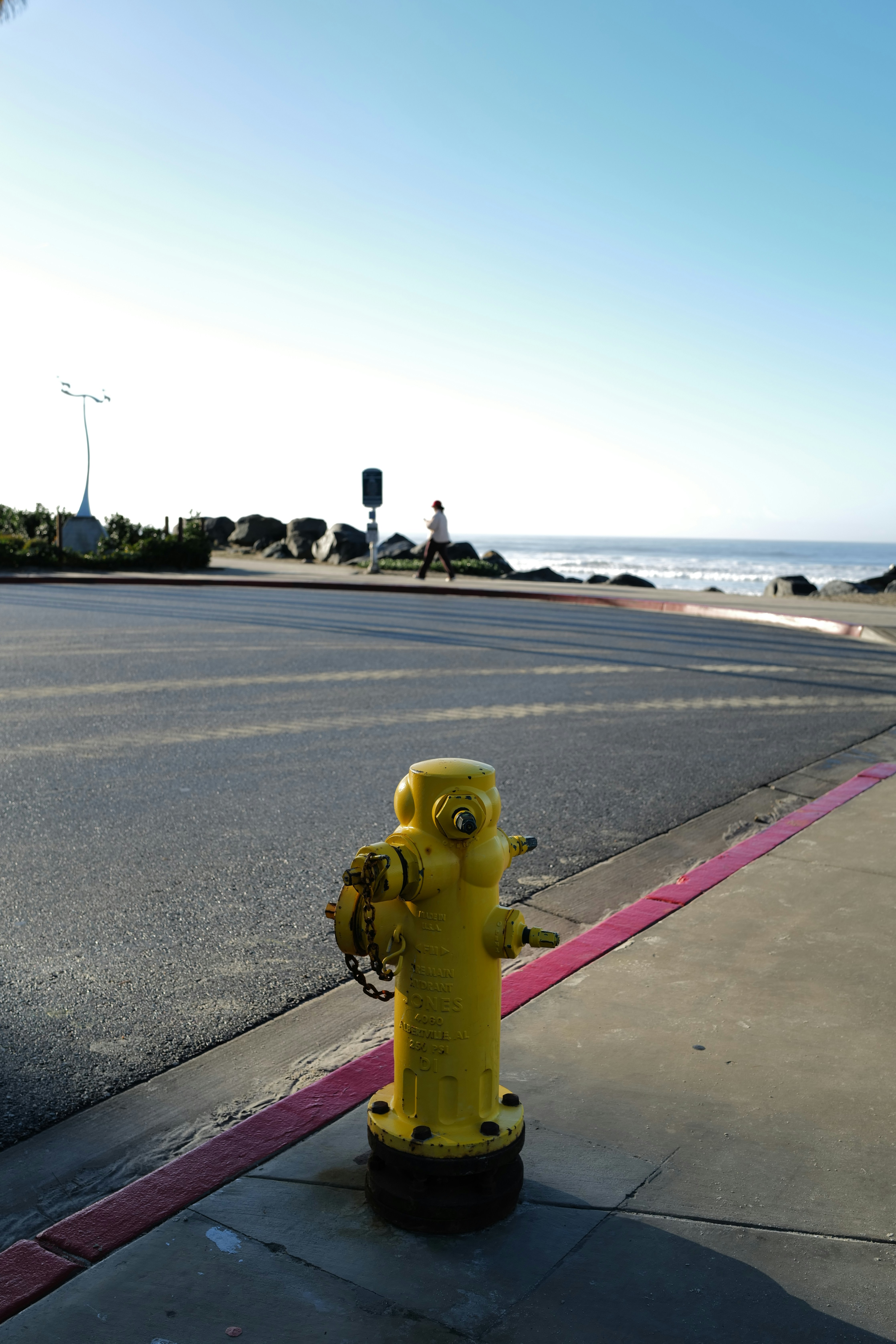 Yellow fire hydrant at the seaside promenade