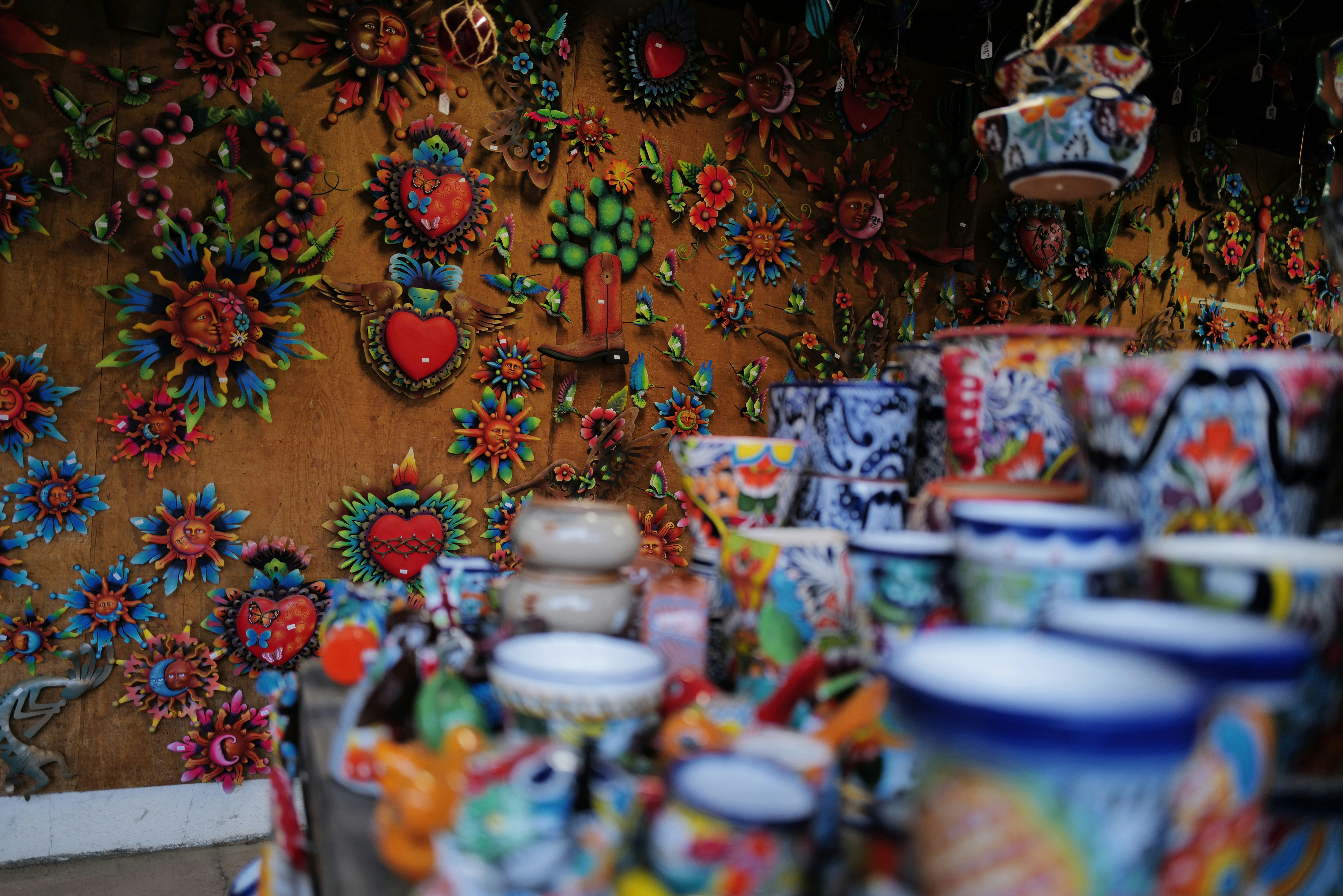 Vivid Ceramics on a Sunlit Studio Wall