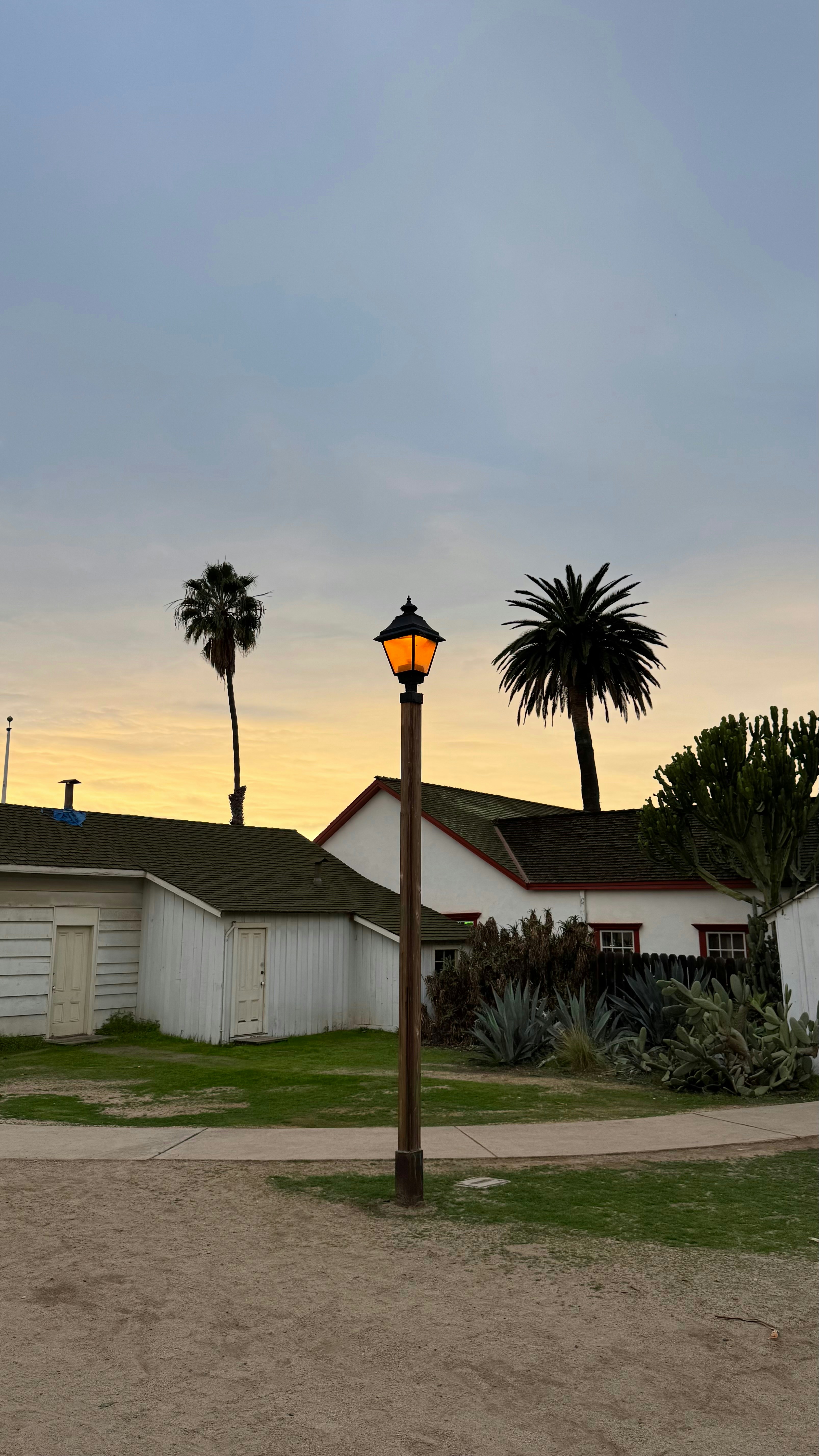 Evening Glow Over a Quiet Coastal Street Lamp