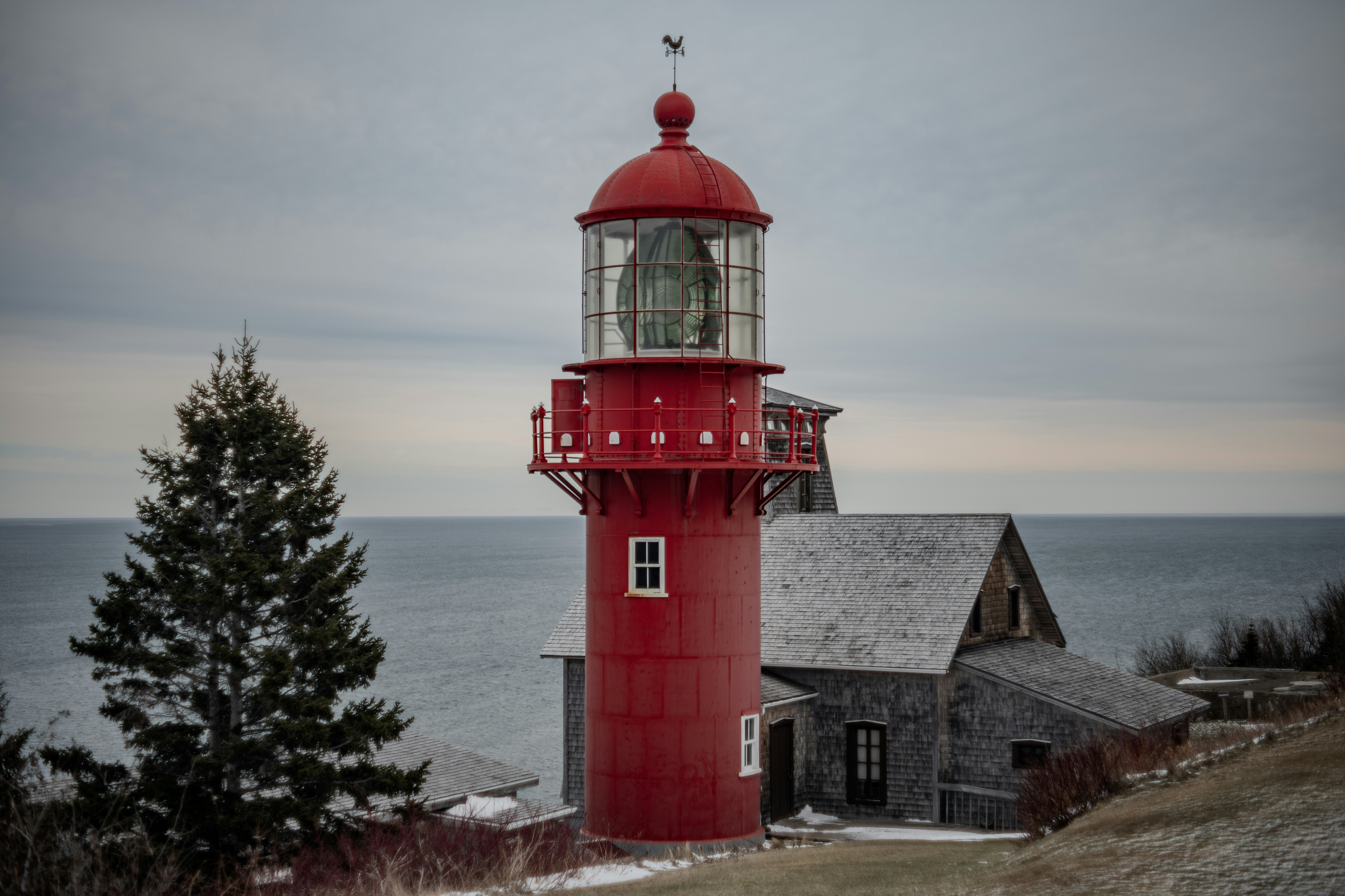 Red Lighthouse over the Sea: Quiet Coastal Keep