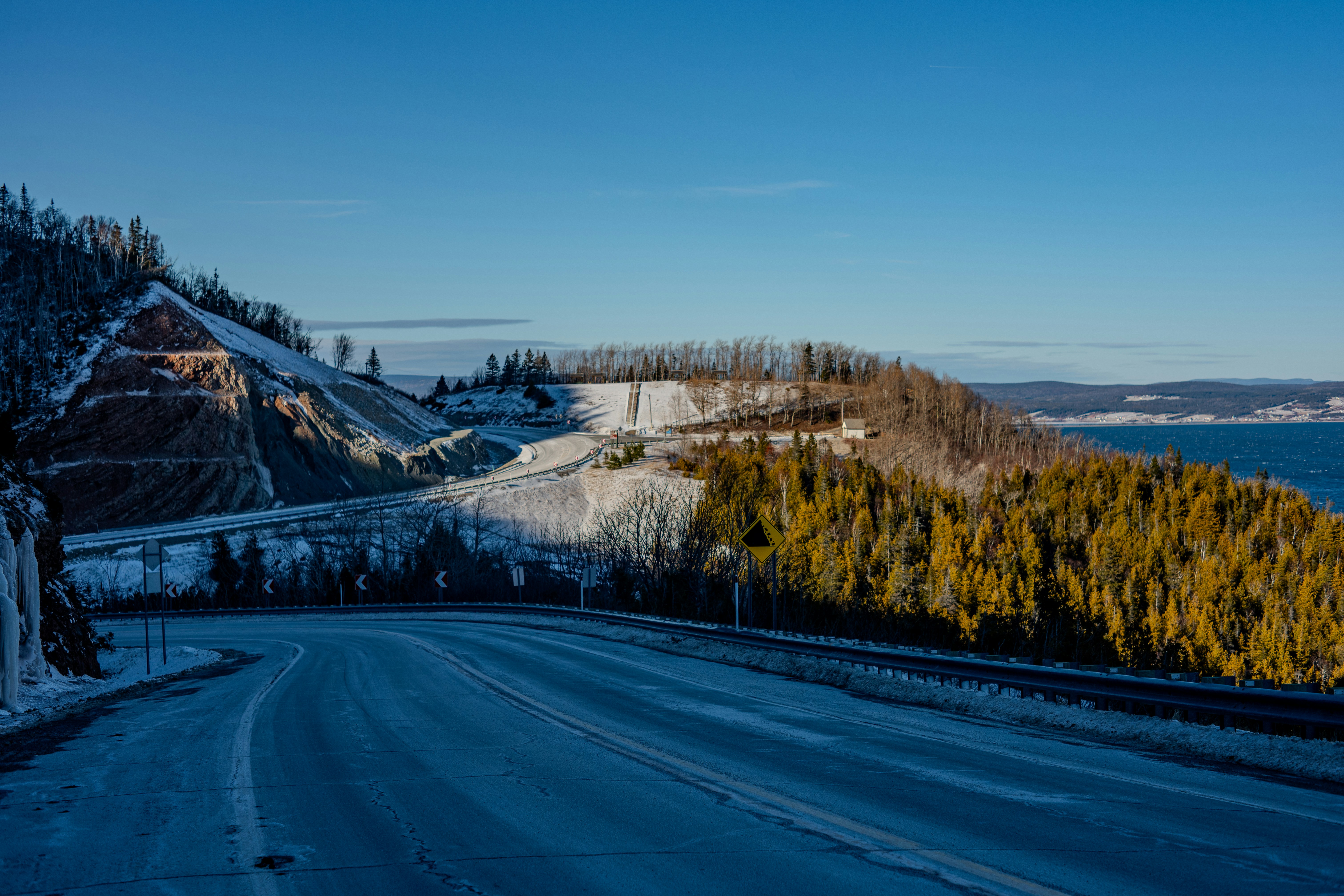 Snowbound Highway Ridges under a Clear Blue Sky
