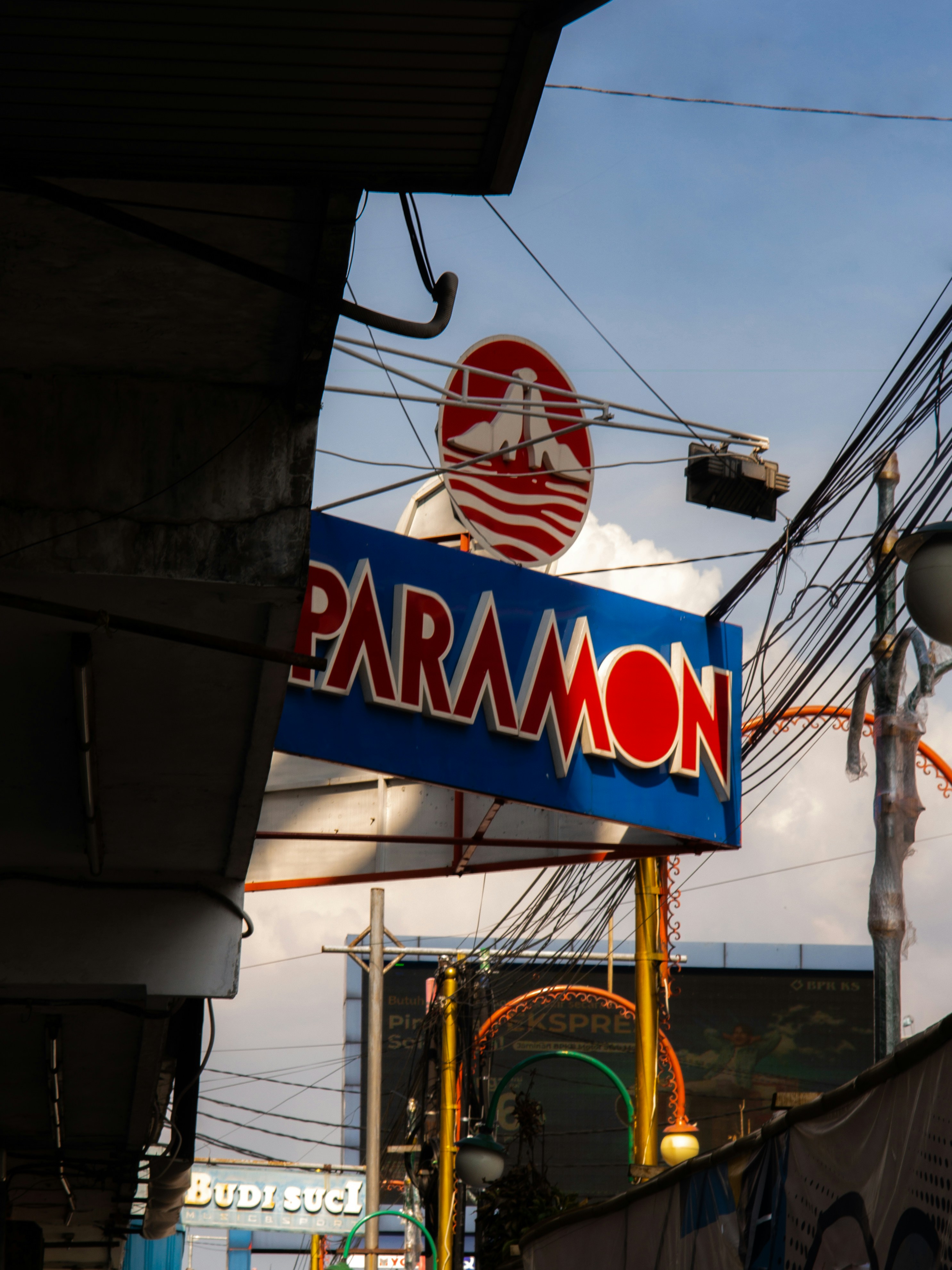 Neon Sign and Wires: A Narrow Street in the City Core