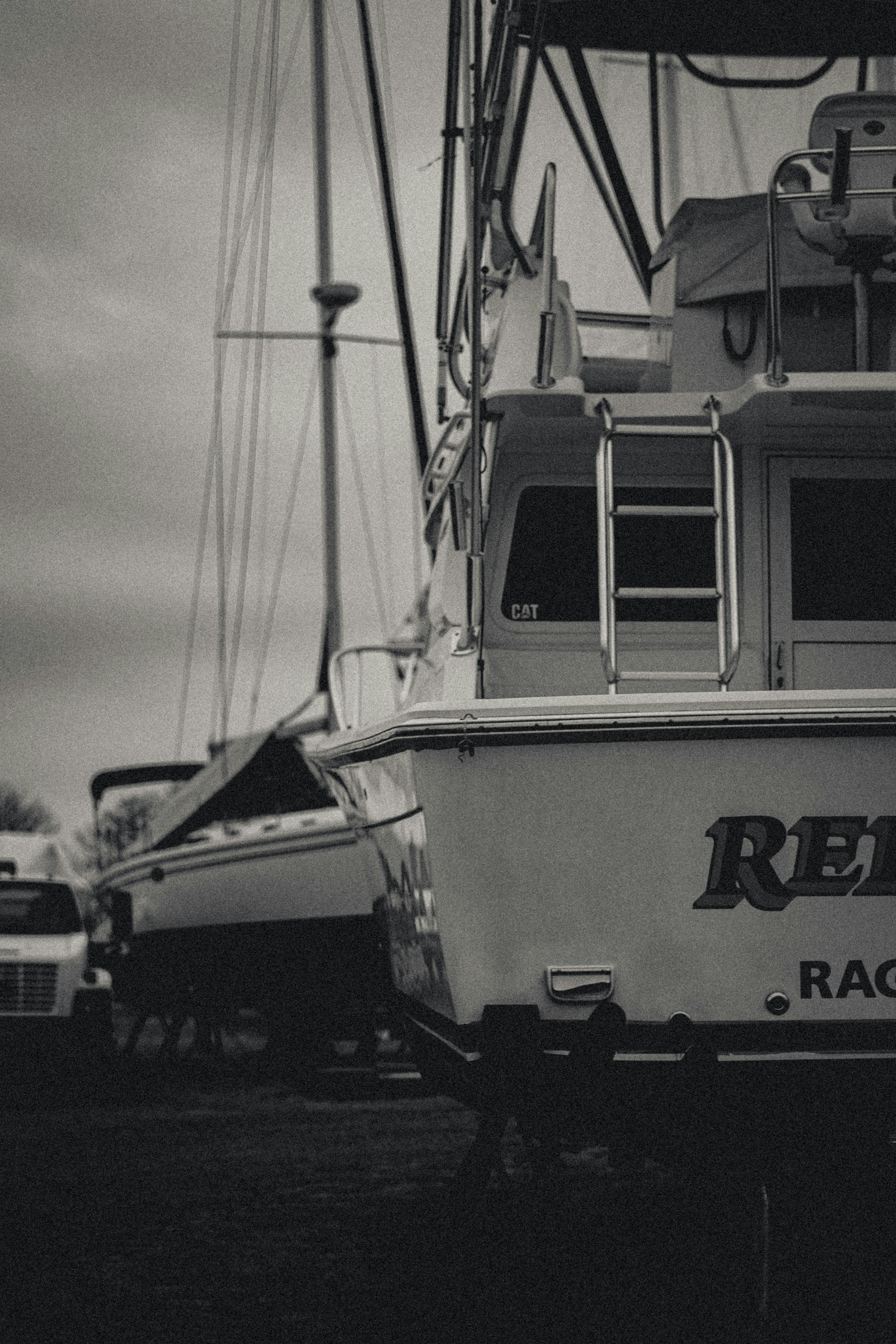 Docked in monochrome: the stern of a sailboat at rest
