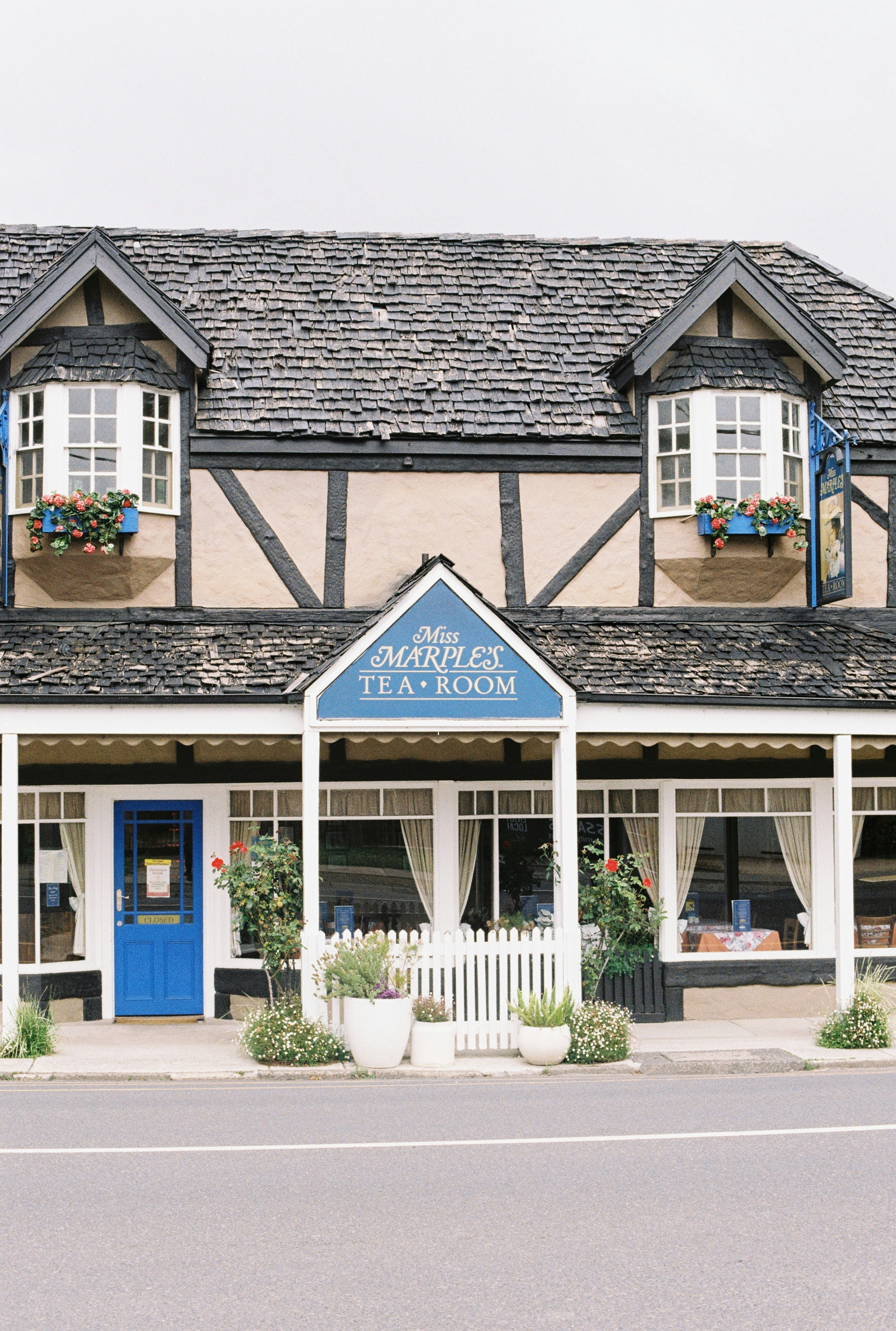 Miss Marple’s Tea Room: A Tudor Facade with Blue Front Door