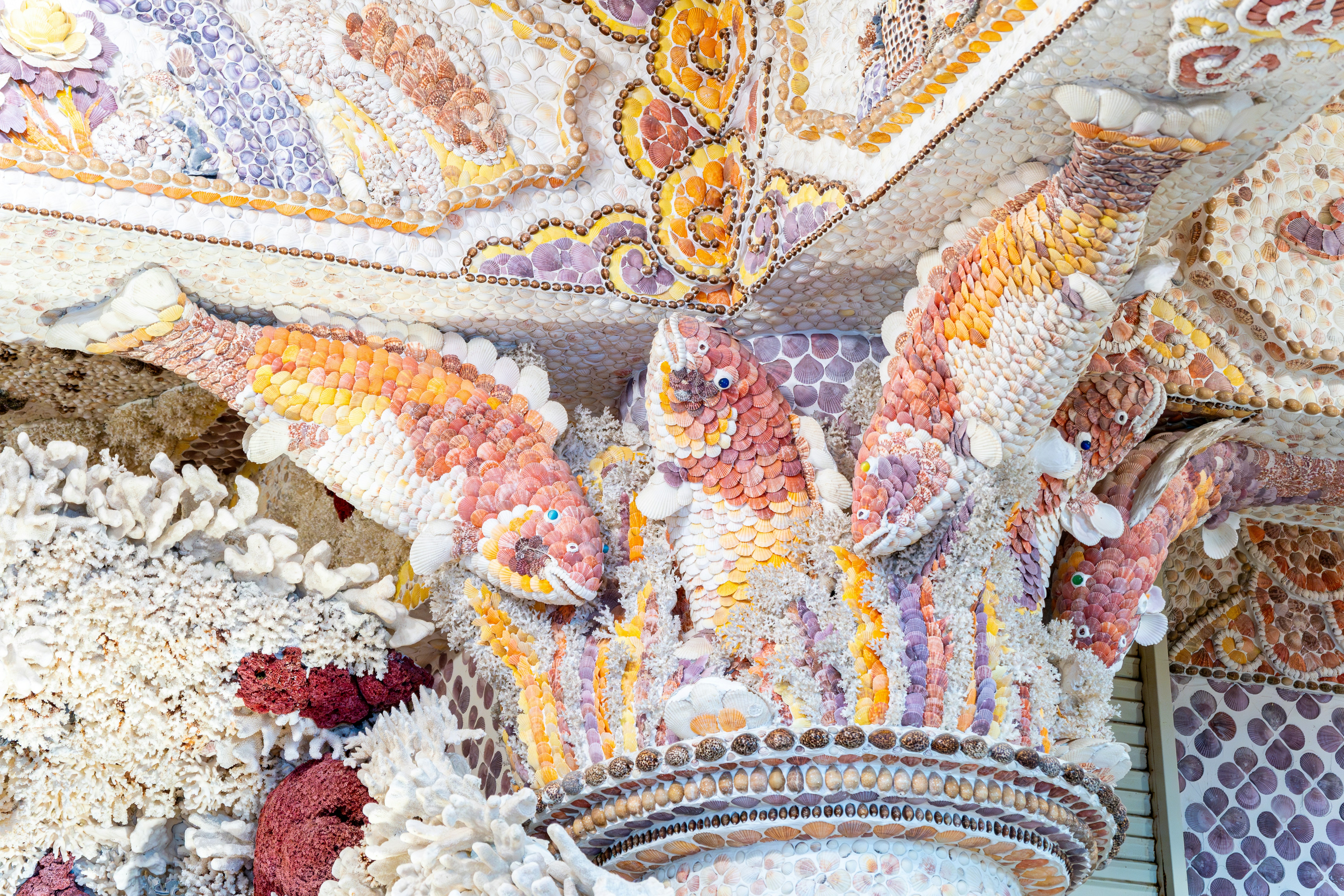 Ornate Dragon Carving: Colorful Mosaic Details on a Sacred Structure