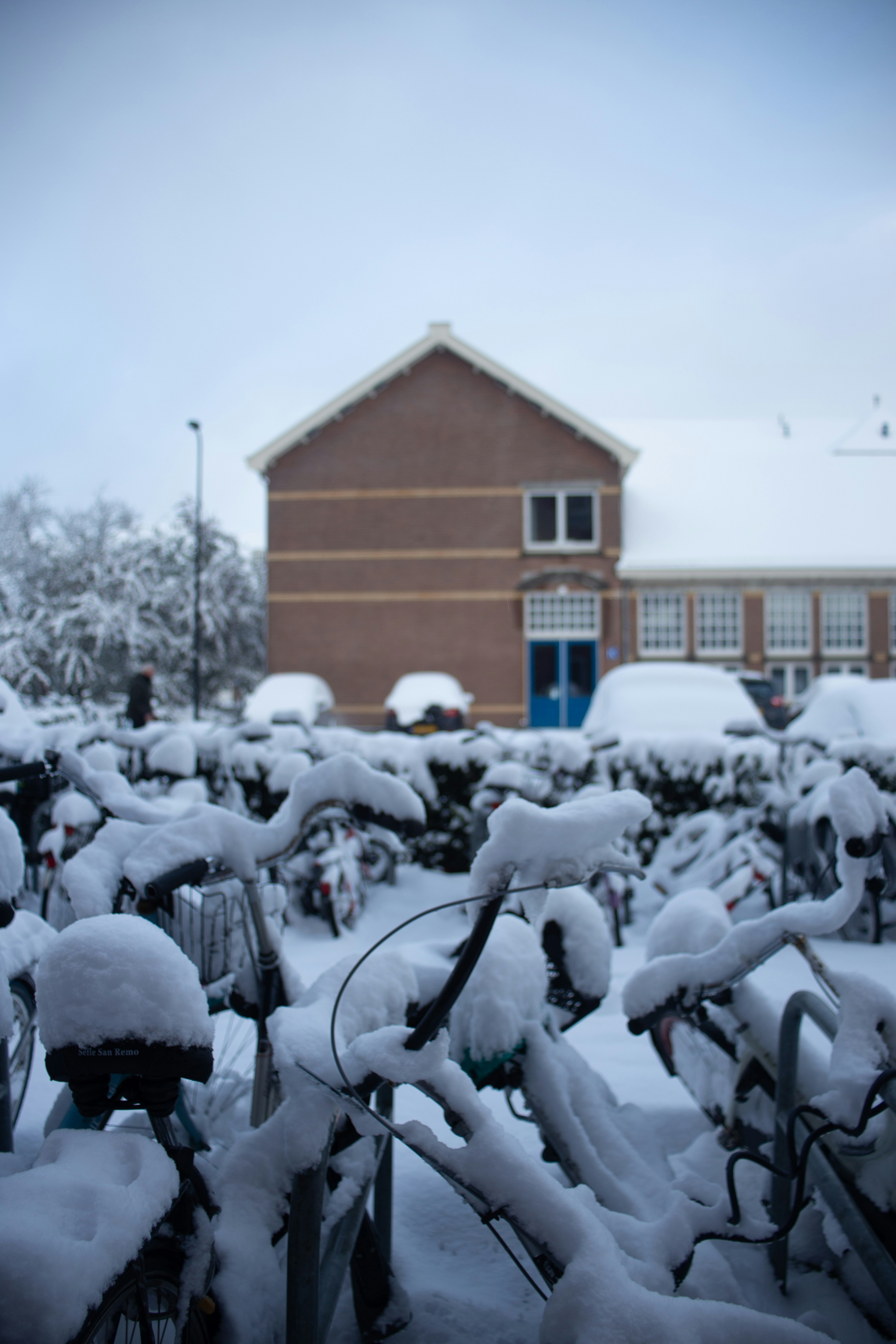 Snowbound Campus: Bikes, Bricks, and a Quiet Blue Morning