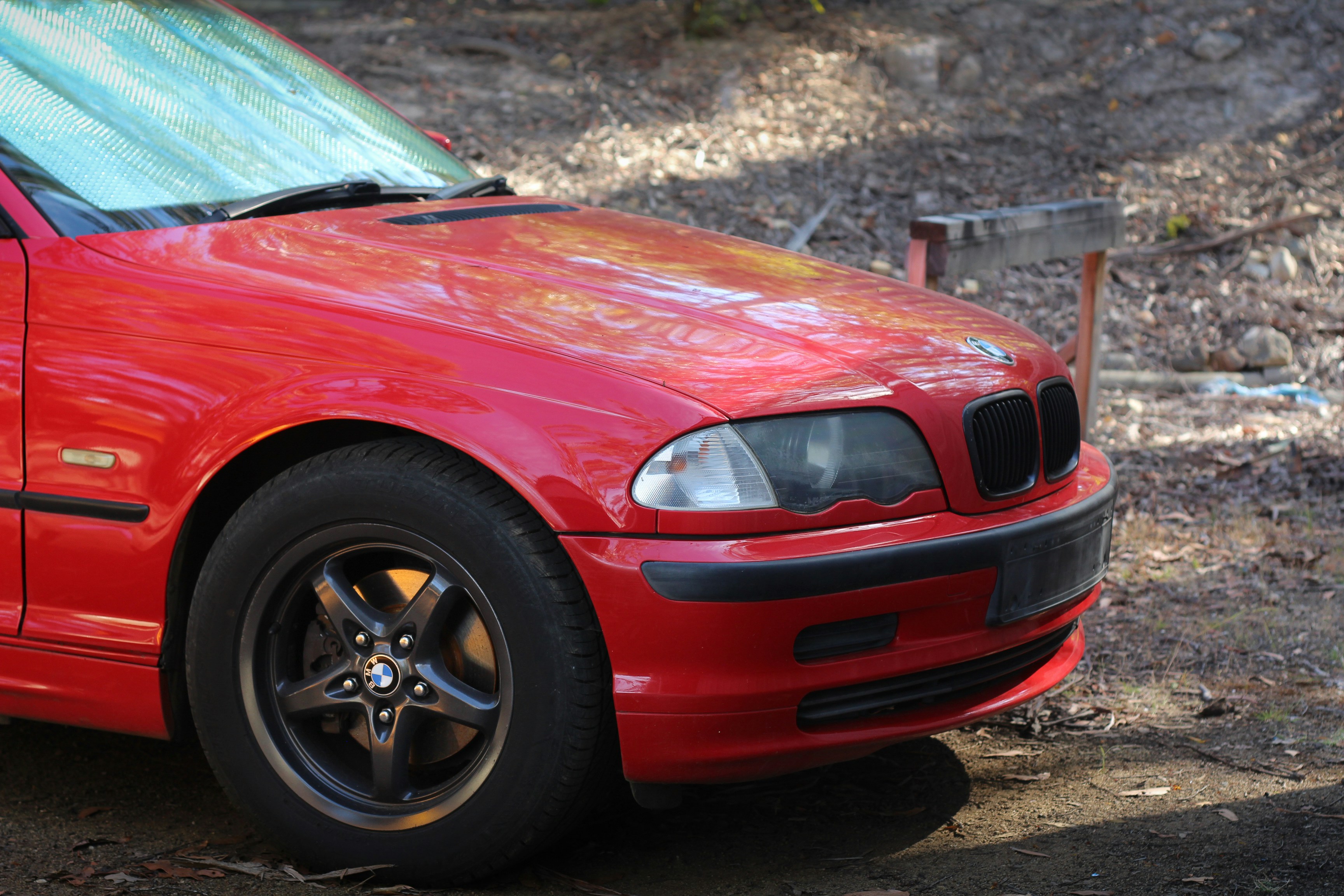 Red Breach: The Front Quarter of a Sporty Car