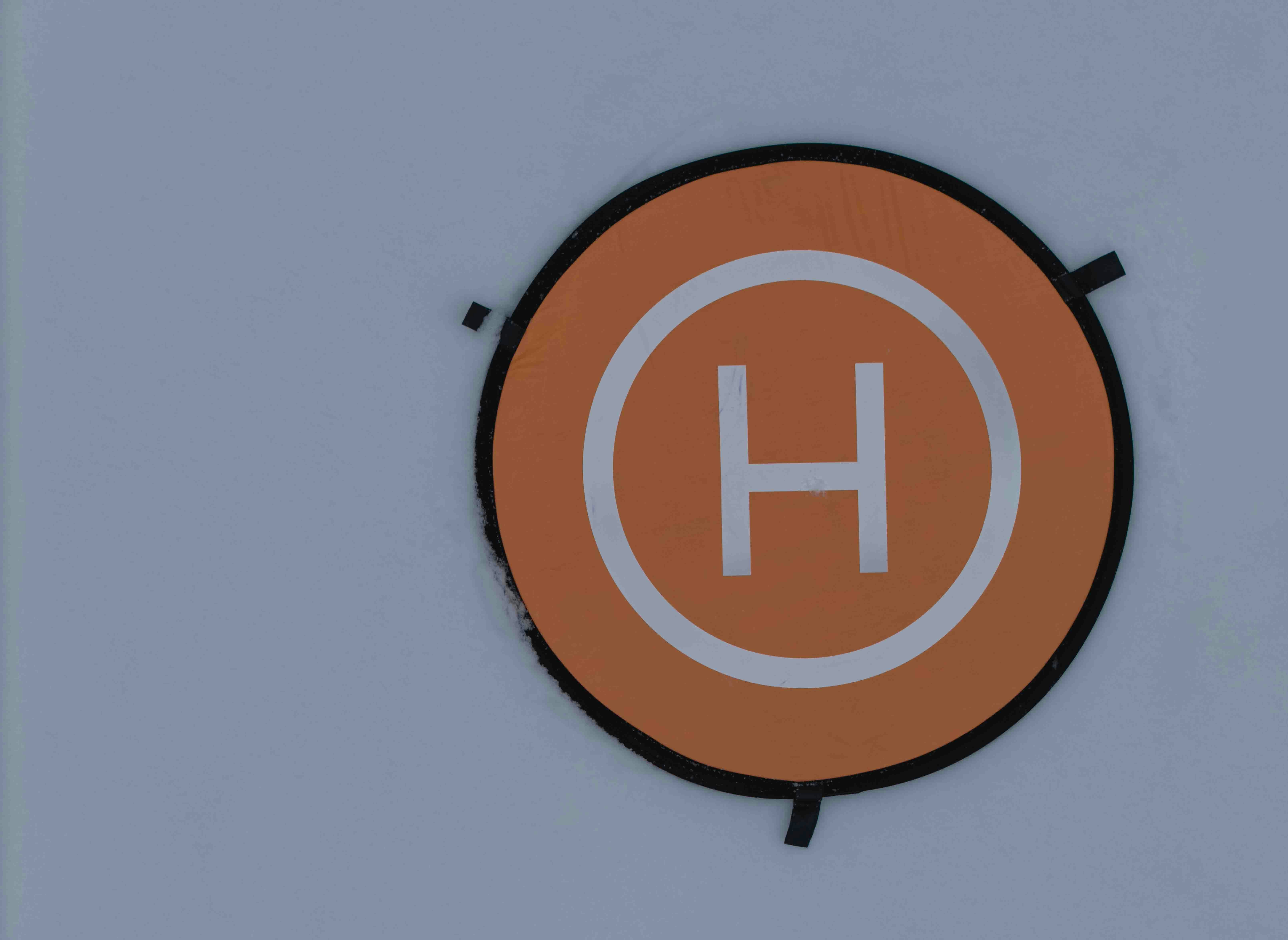 Orange helipad with white h symbolBernd 📷 Dittrich