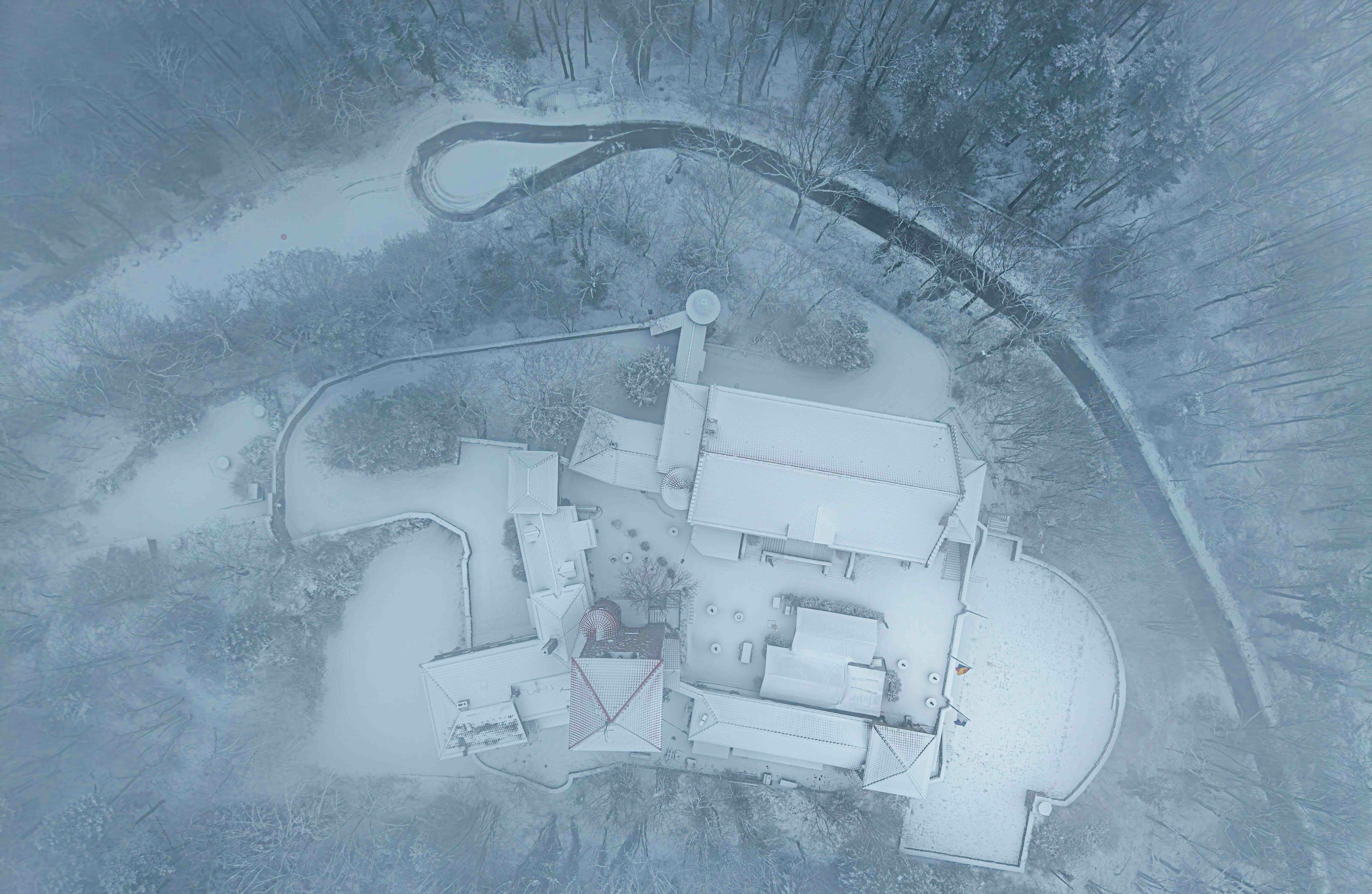 Snowbound Estate from Above: A Quiet Winter Compound under Pale Haze