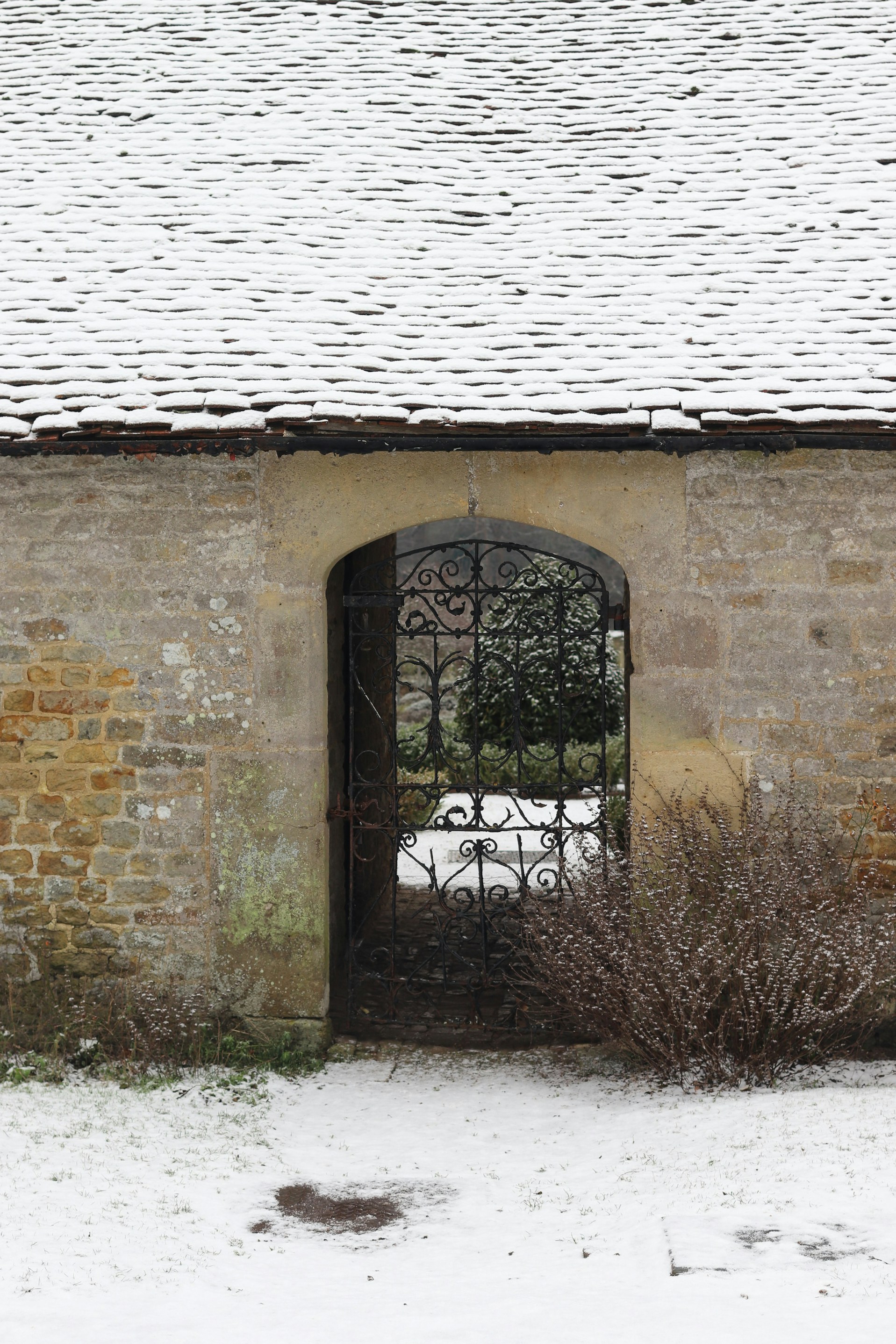 Iron Gate Under Snow-Capped Roof
