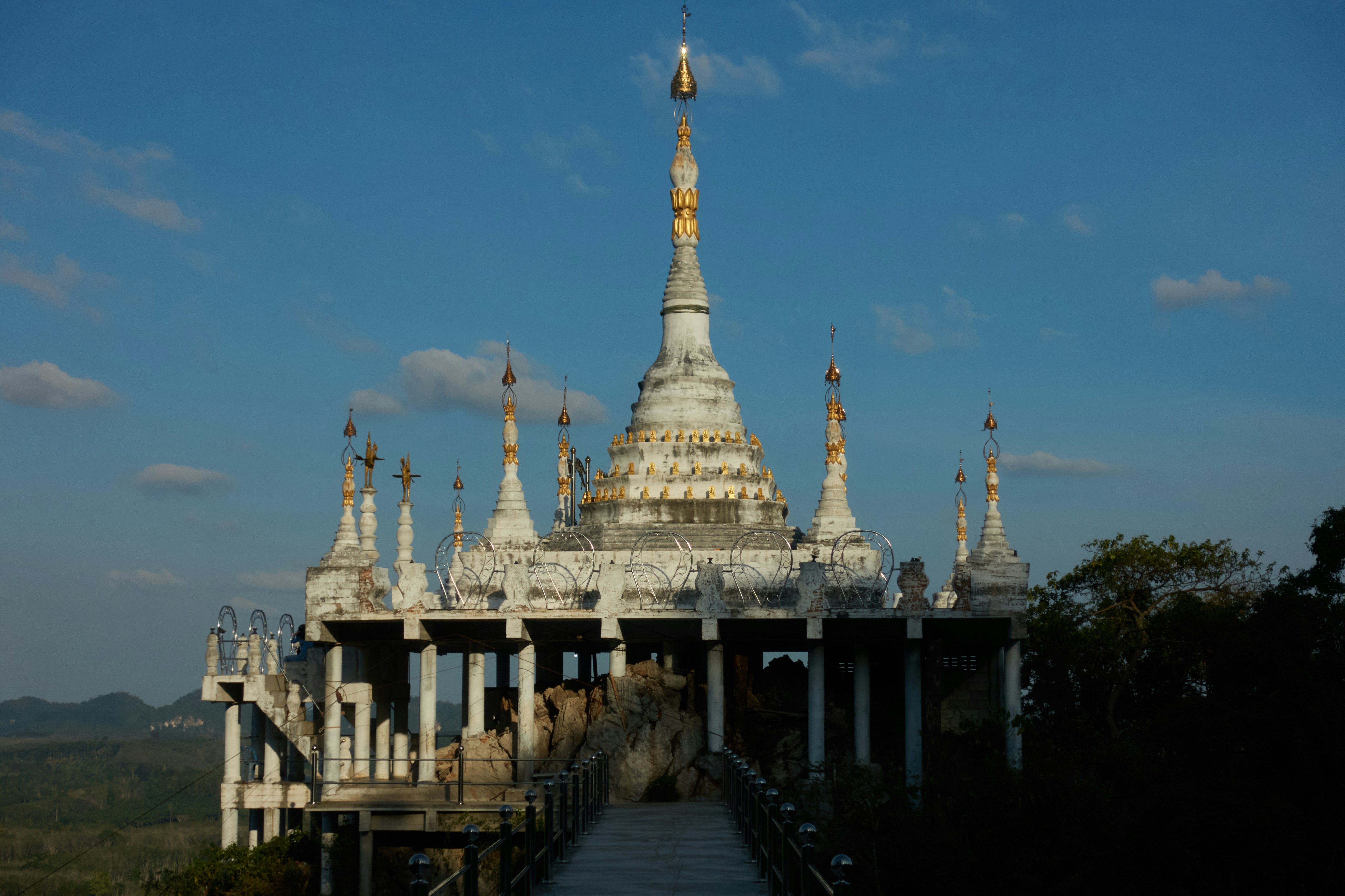 White Pagoda Ascending: A Hilltop Shrine Drenched in Noon Sun