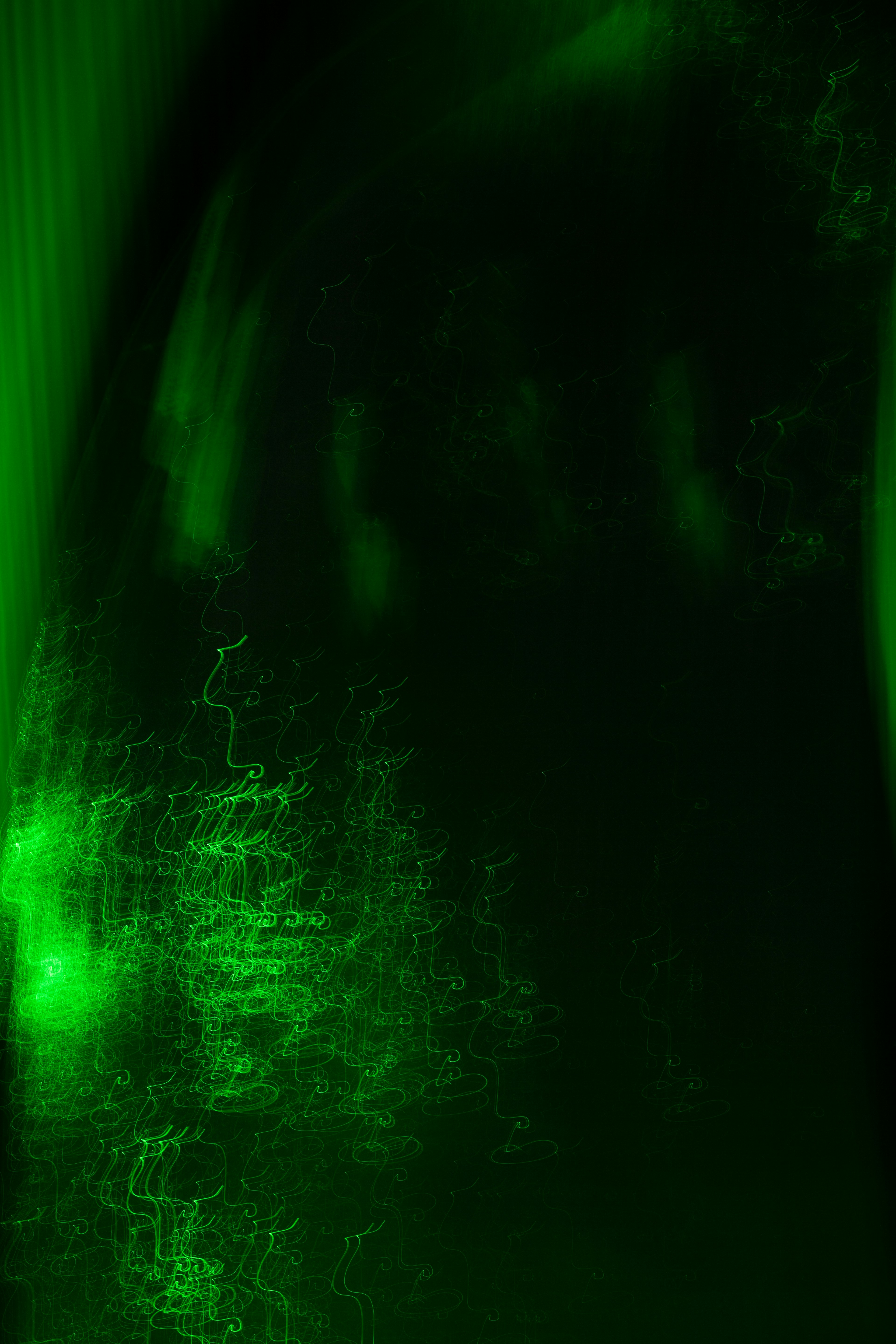 Aurora in Green: Abstract Light Trails Across a Dark Canvas