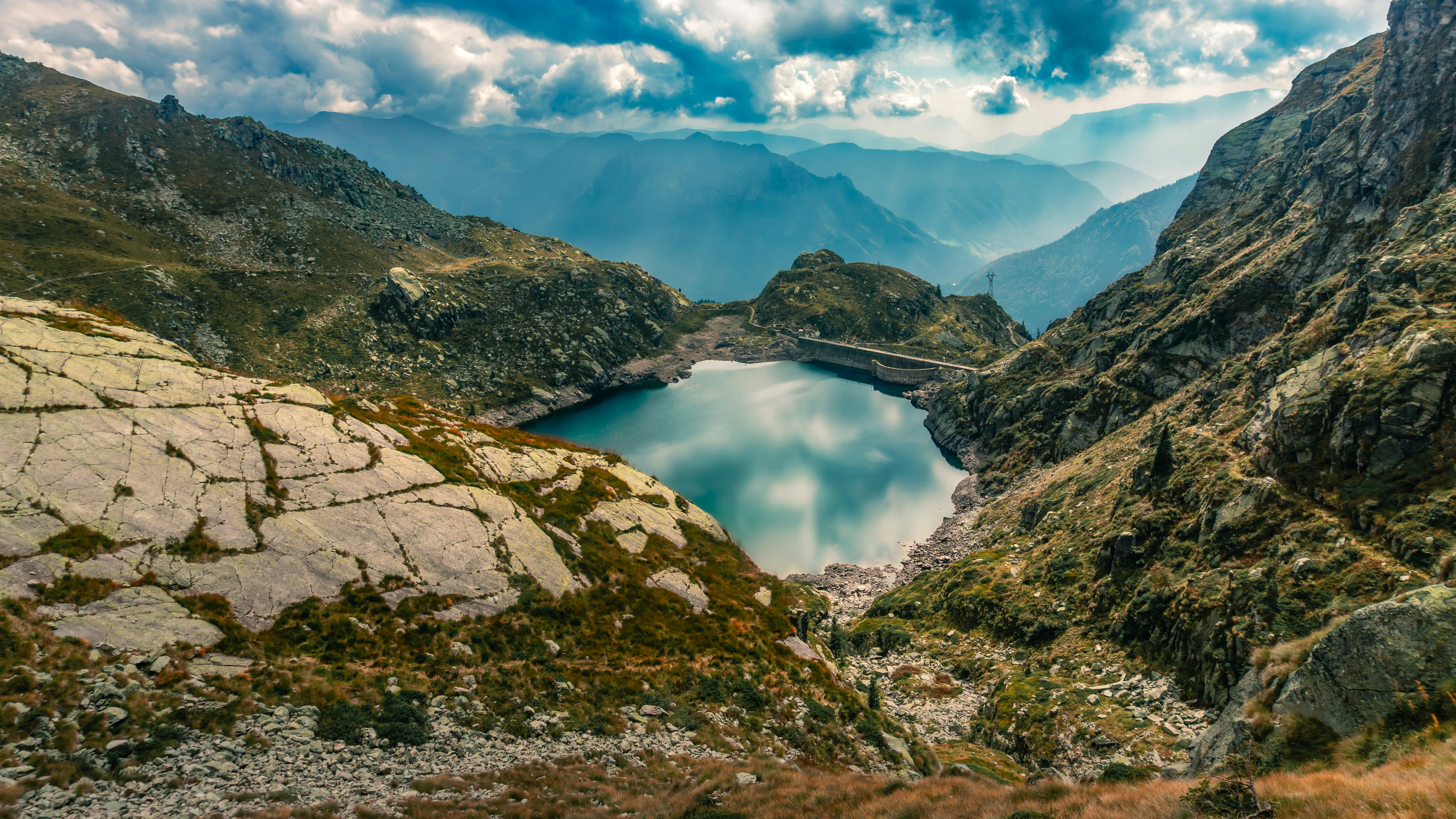 Glacial Staircase: A Valley of Teal Reflections Between Jagged Peaks