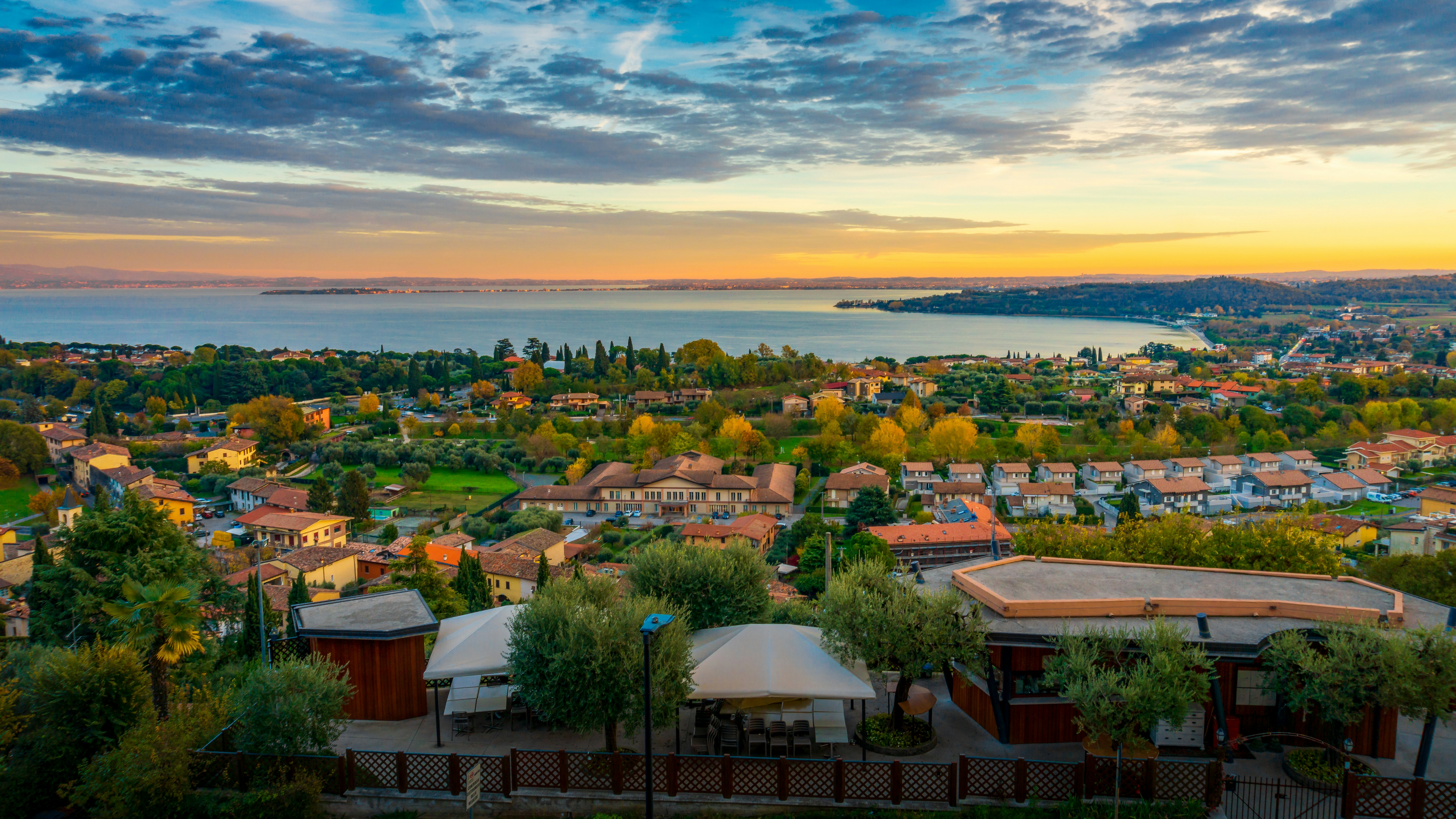 Dusk on the Suburban Edge: Sunset over a Calm Coastal Town