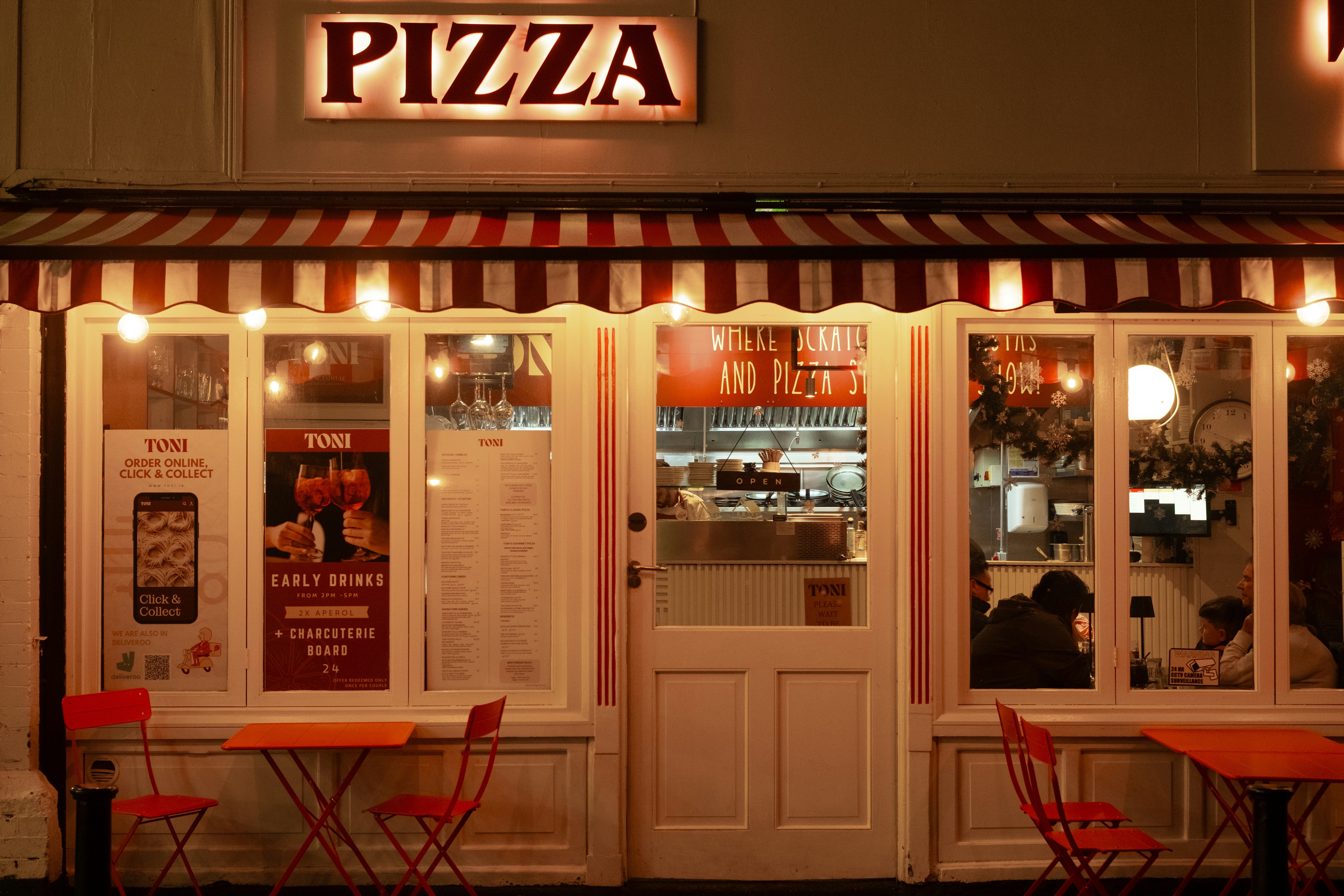 Warm Glow of a Traditional Pizzeria at Night